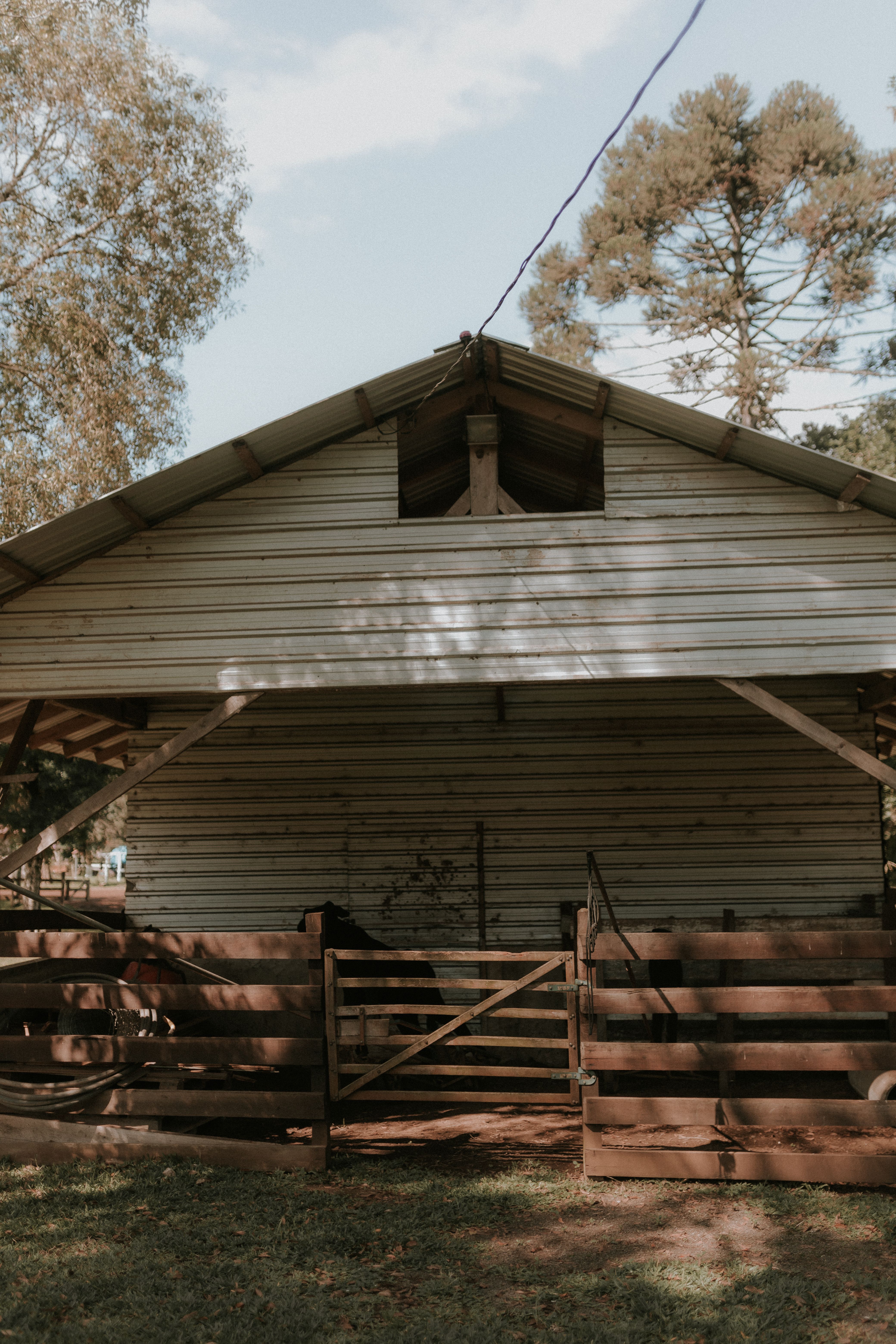 Rustic Wooden Barn in Tranquil Countryside Setting · Free Stock Photo
