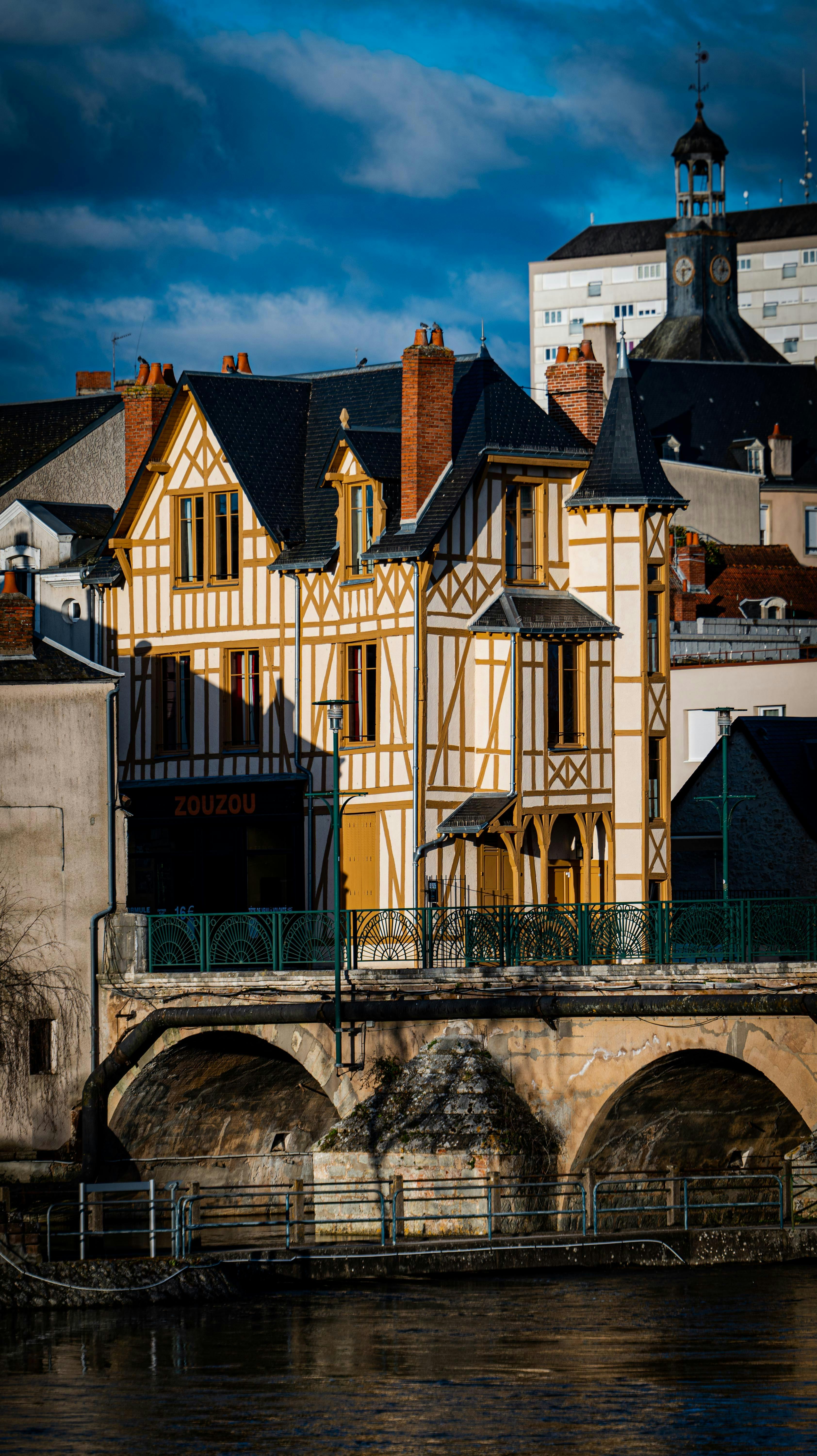 Charming European Timber House Overlooking River · Free Stock Photo