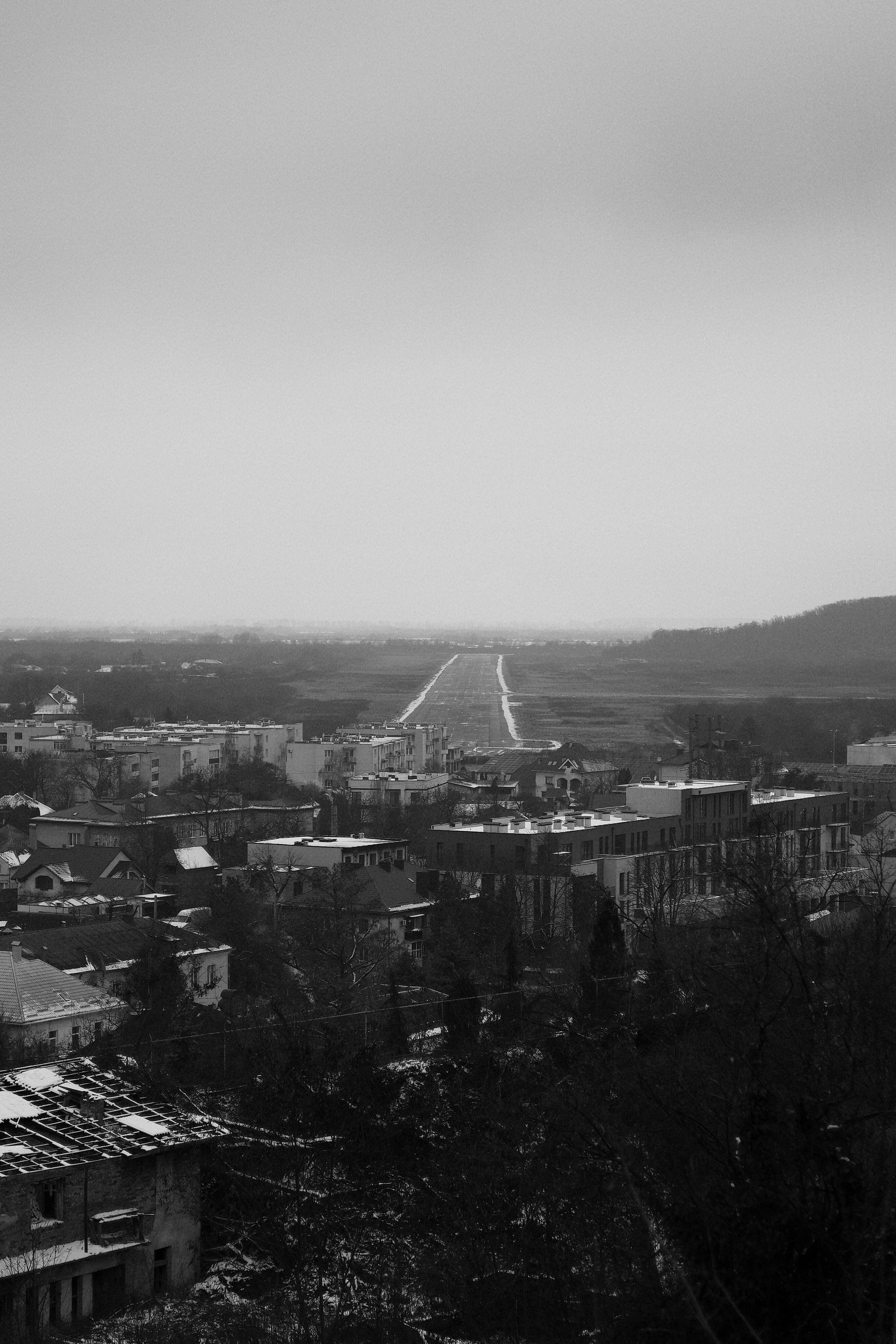 Misty Urban Landscape with Runway View · Free Stock Photo