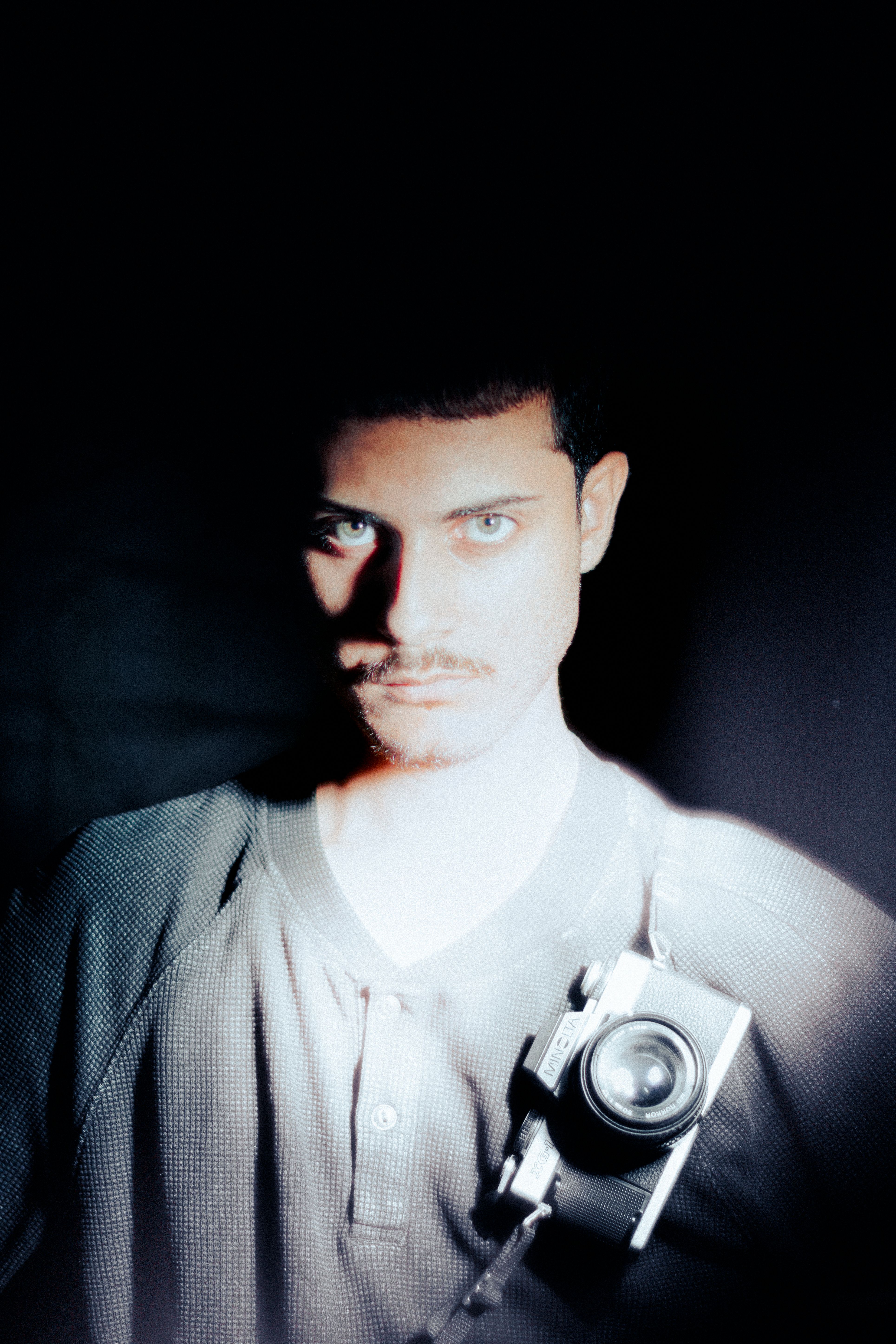 Dramatic Portrait of a Man in Shadows · Free Stock Photo