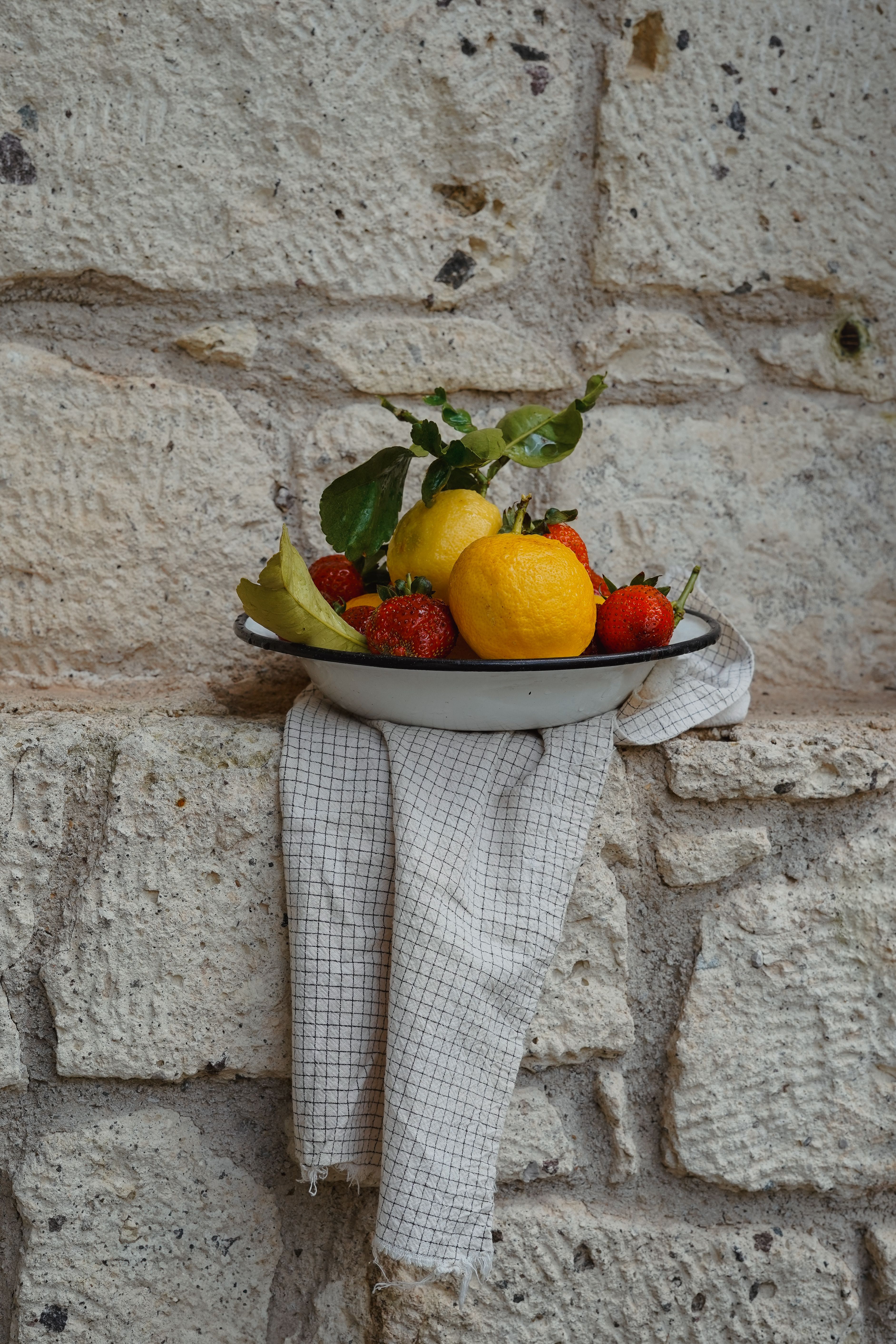 Rustic Fruit Bowl on Stone Wall · Free Stock Photo