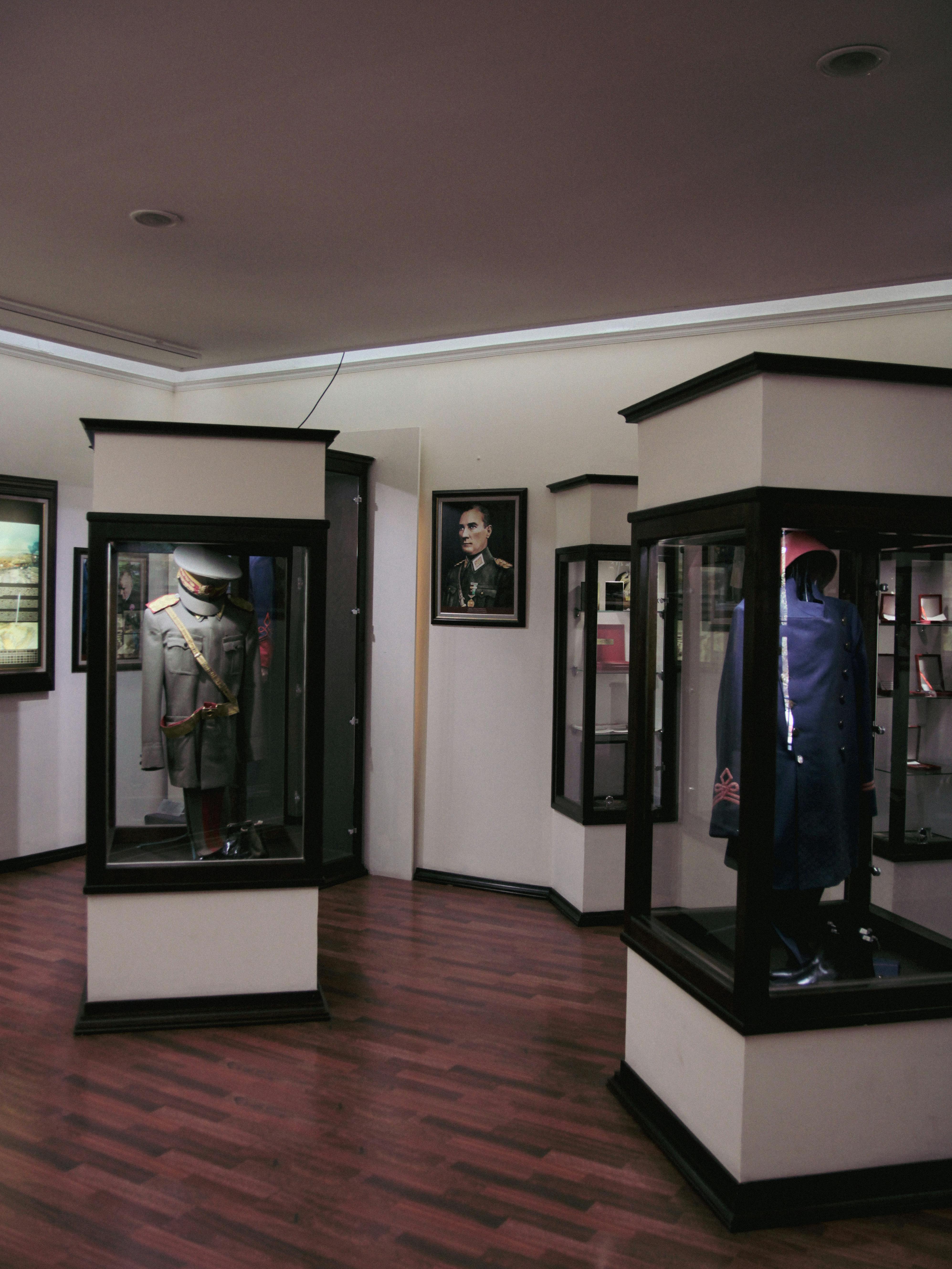 Historical Military Uniforms in Museum Display · Free Stock Photo