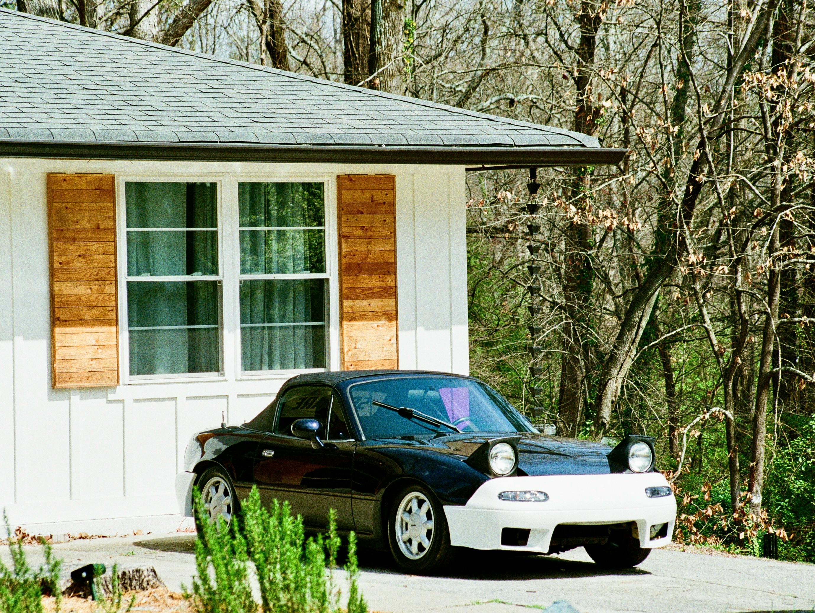 Vintage Mazda Miata by Rustic Cabin in Kennesaw · Free Stock Photo