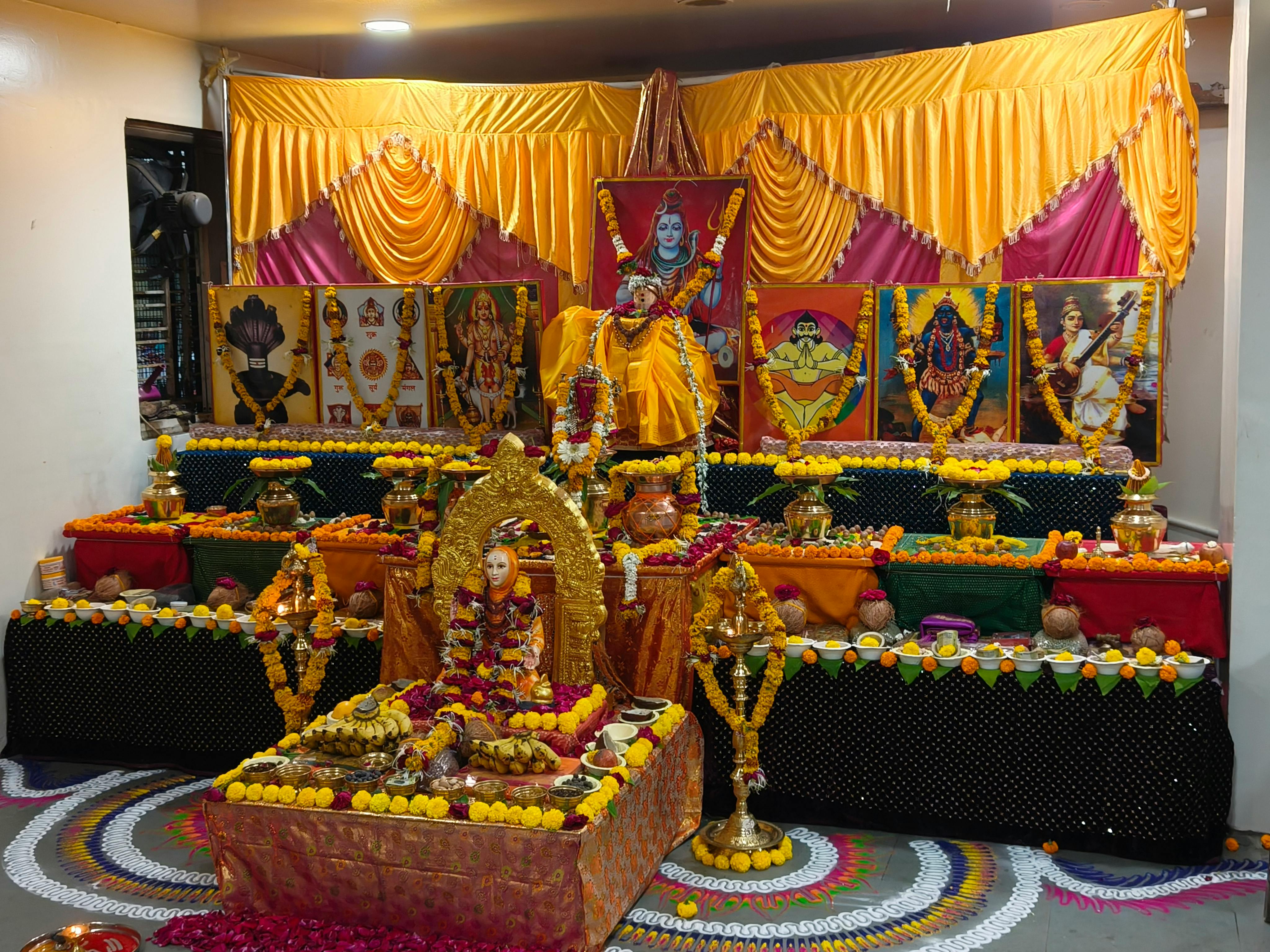 Vibrant Hindu Festival Altar with Deity Statues · Free Stock Photo
