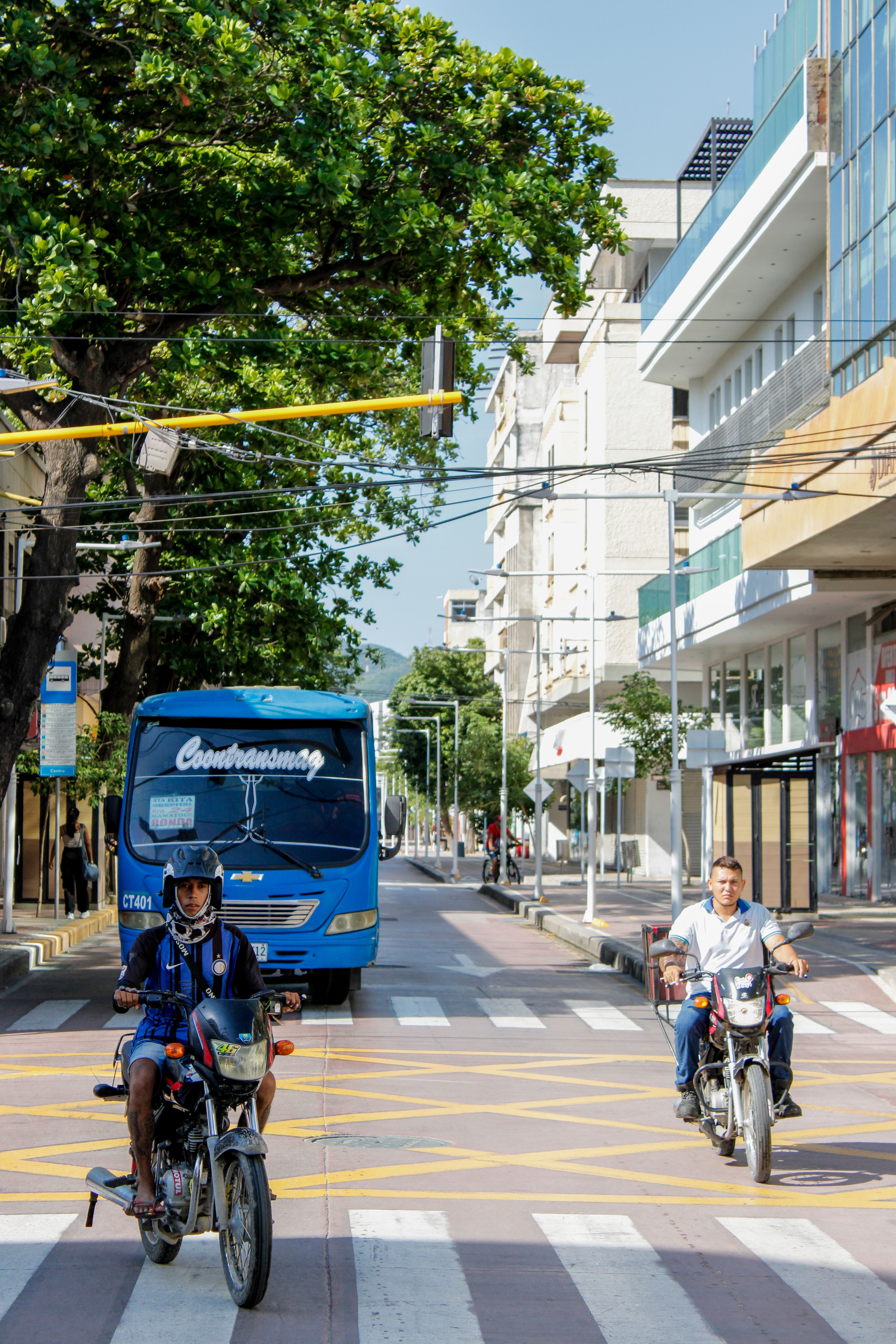 Urban Street Scene in Santa Marta with Motorcyclists · Free Stock Photo