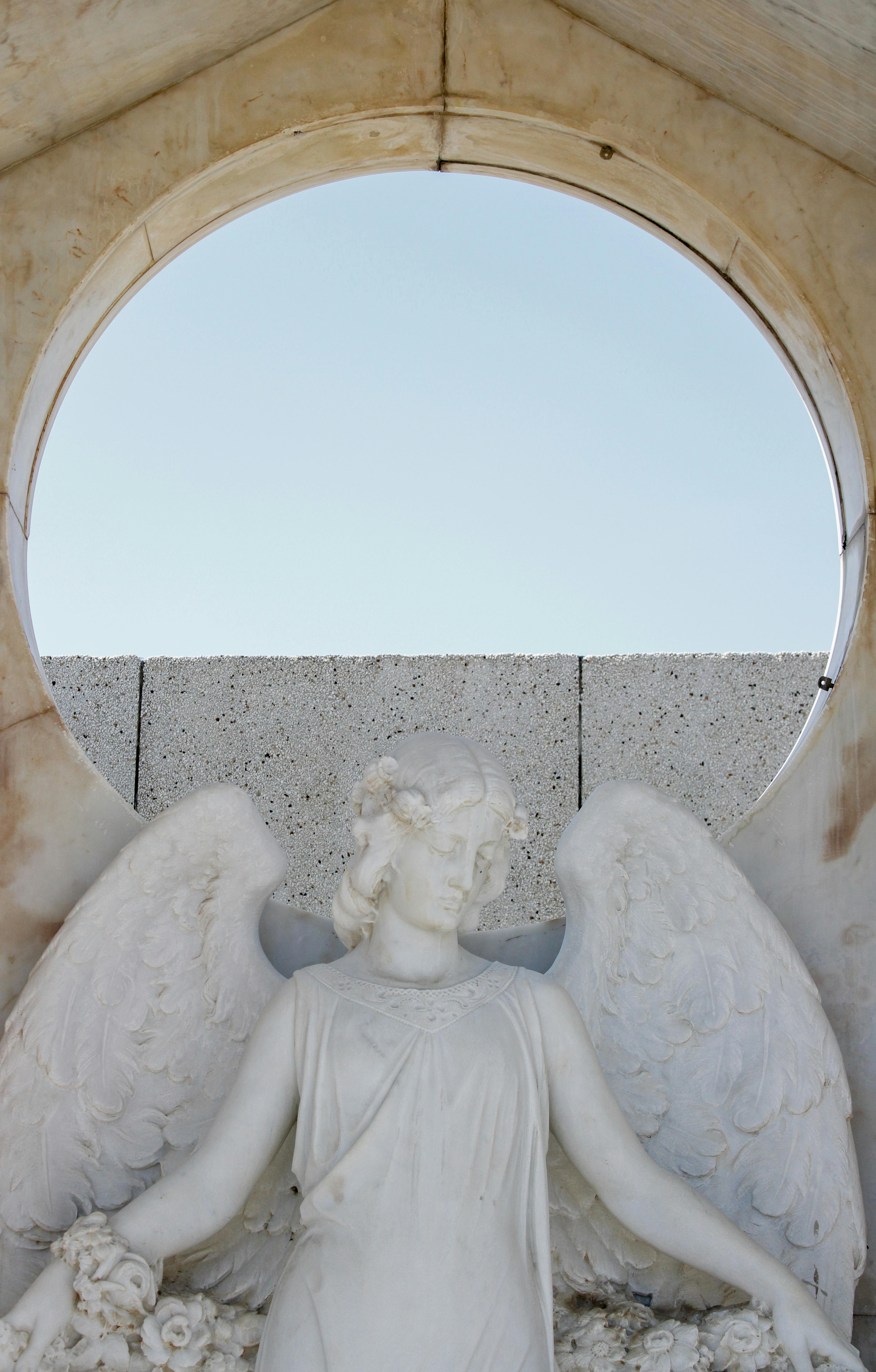 Marble Angel Statue under Circular Archway · Free Stock Photo