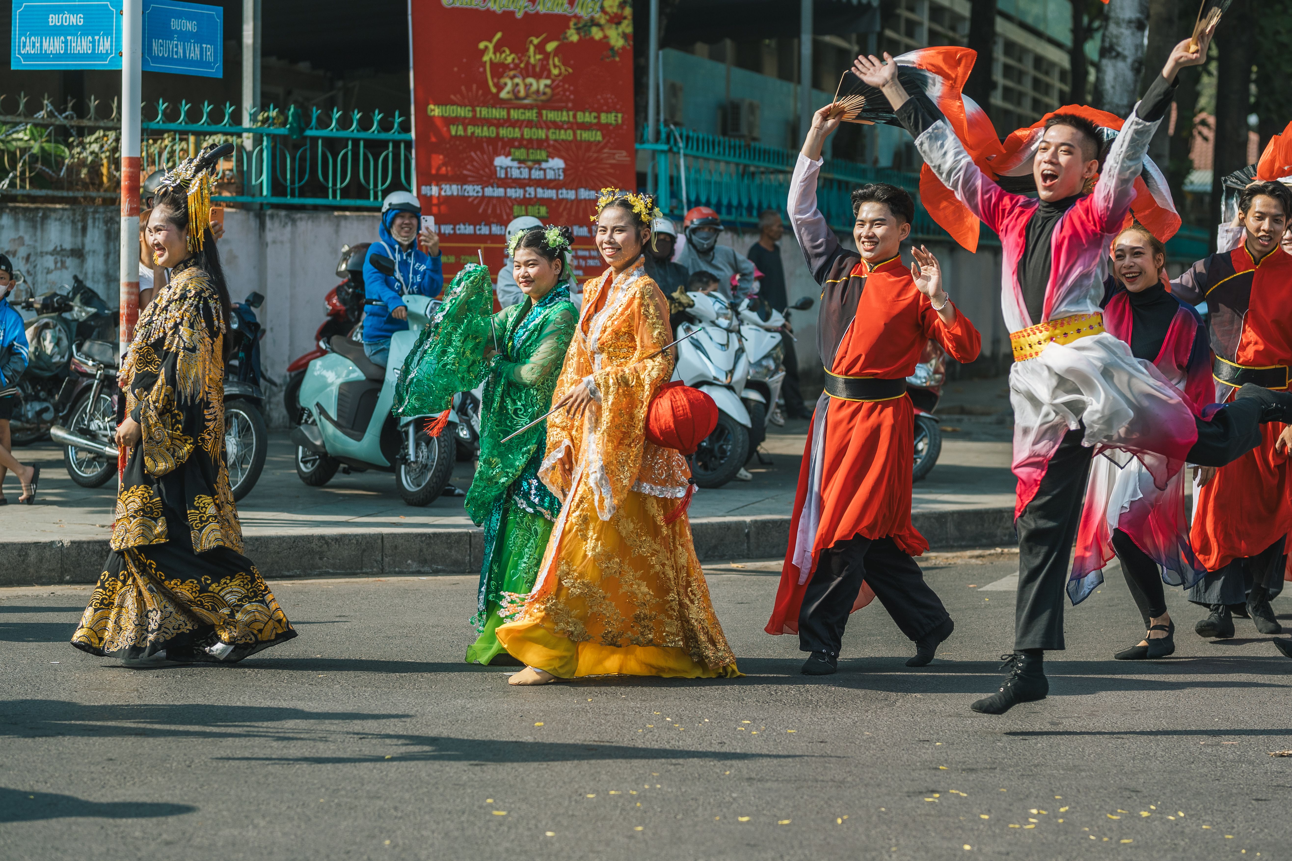 Vibrant Asian Street Parade in Traditional Costumes · meta.free_stock.photo