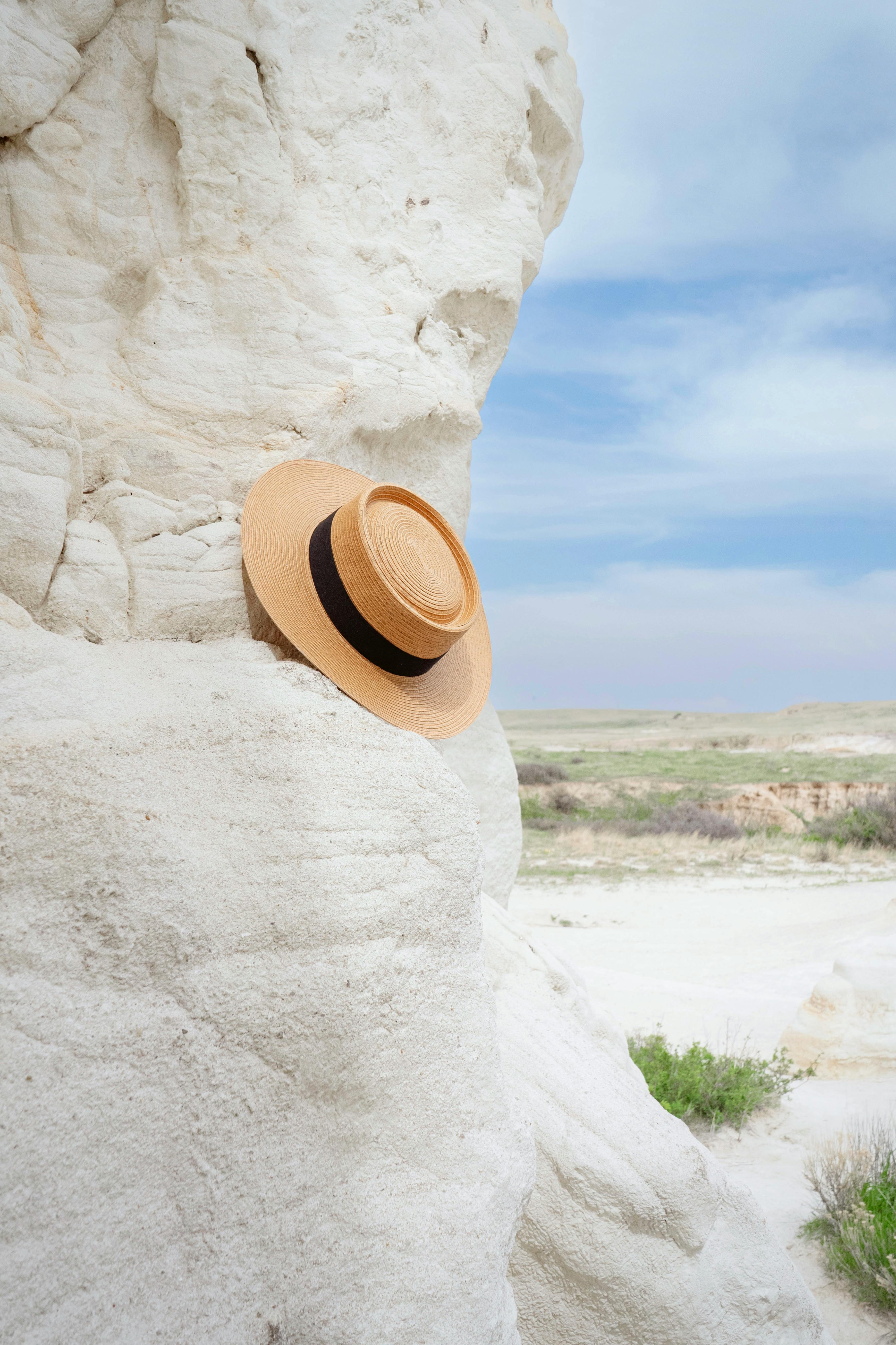 Straw Hat on White Rock Landscape · Free Stock Photo