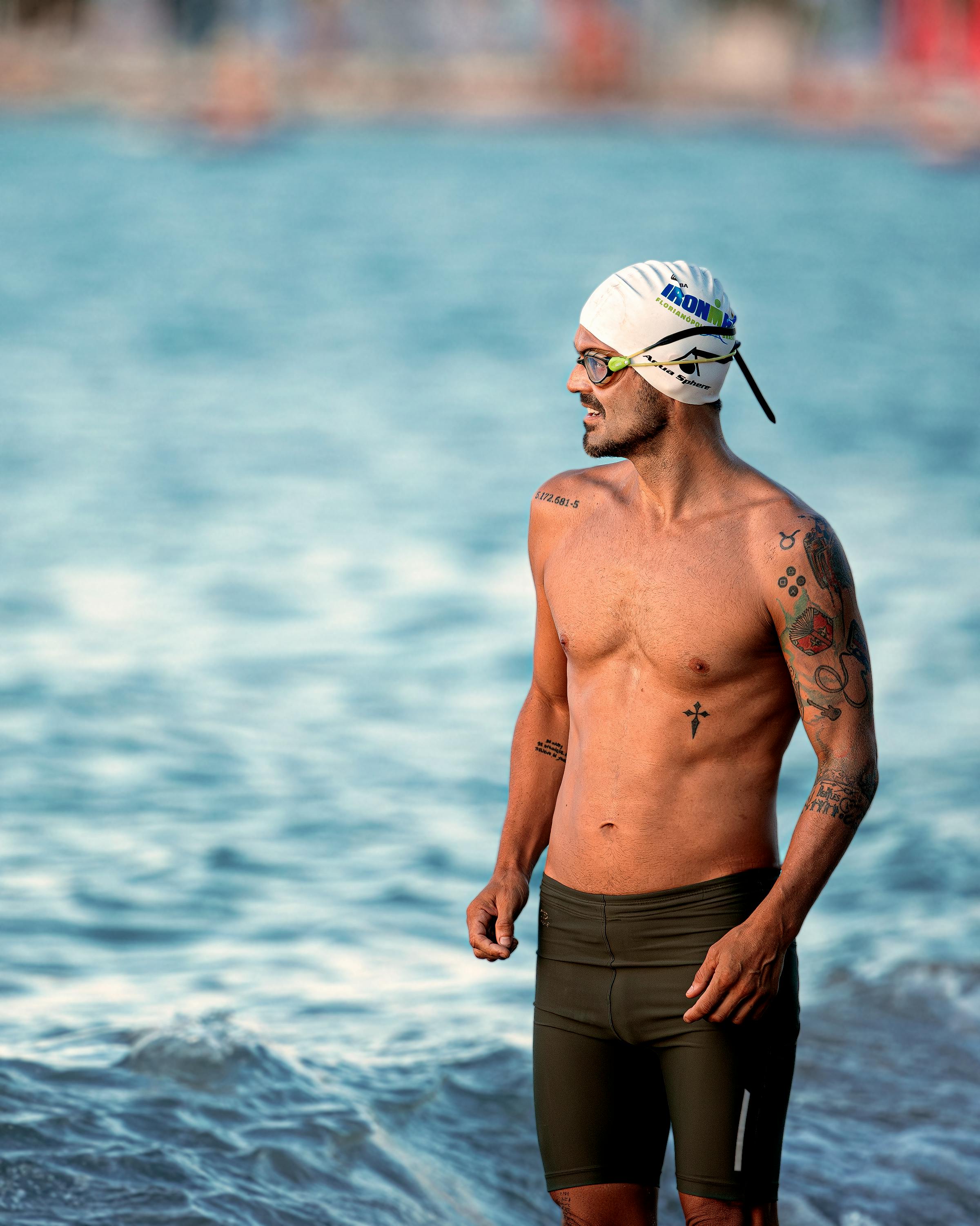 Male Athlete Preparing for Ocean Swim · Free Stock Photo