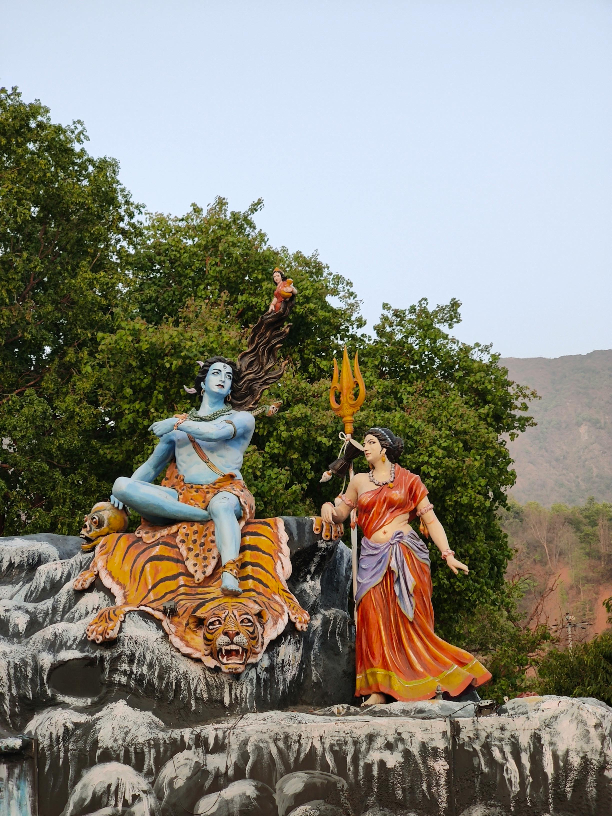 Colorful Hindu Deities Statues in Natural Landscape · Free Stock Photo