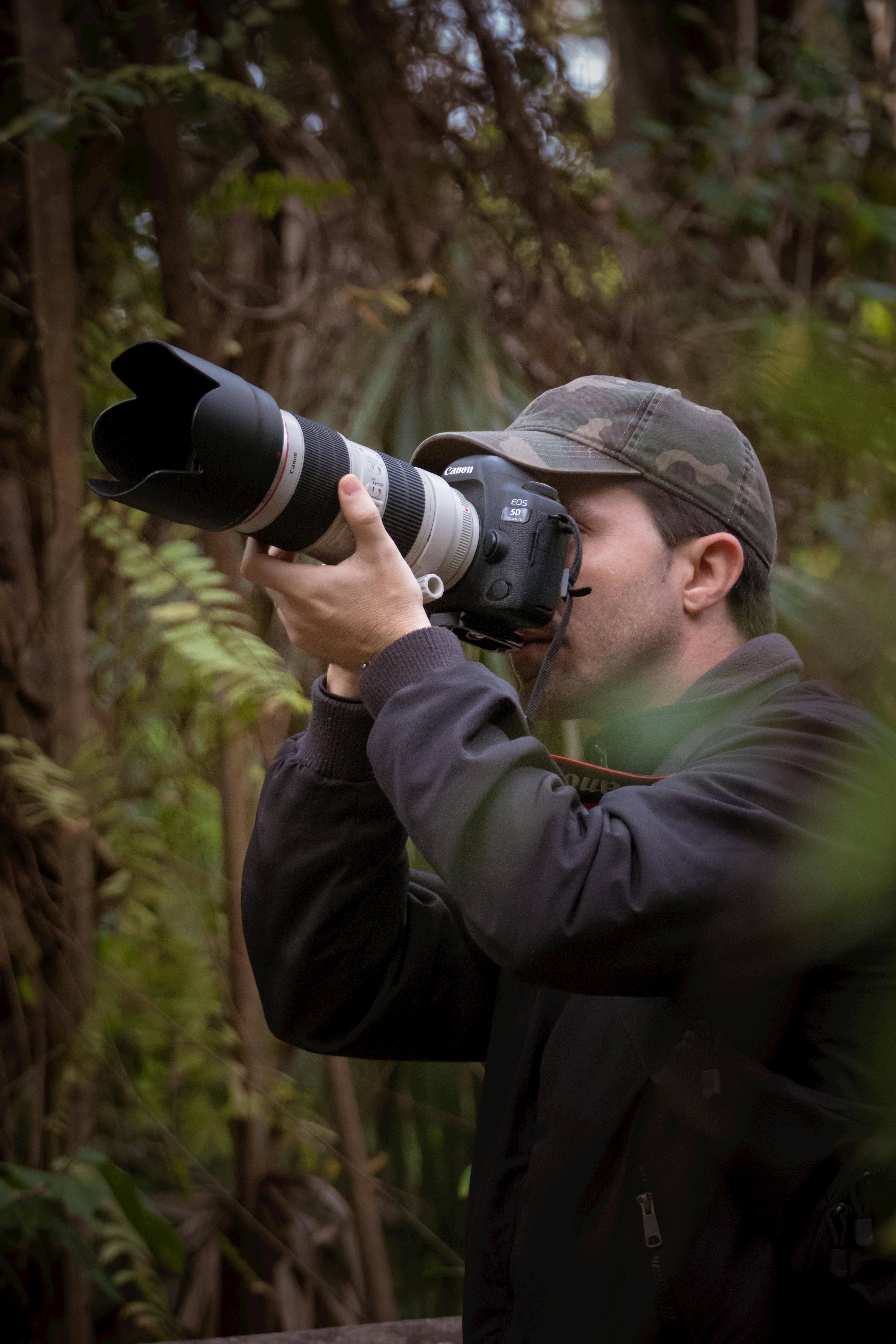 Photographer Capturing Nature with Telephoto Lens · Free Stock Photo