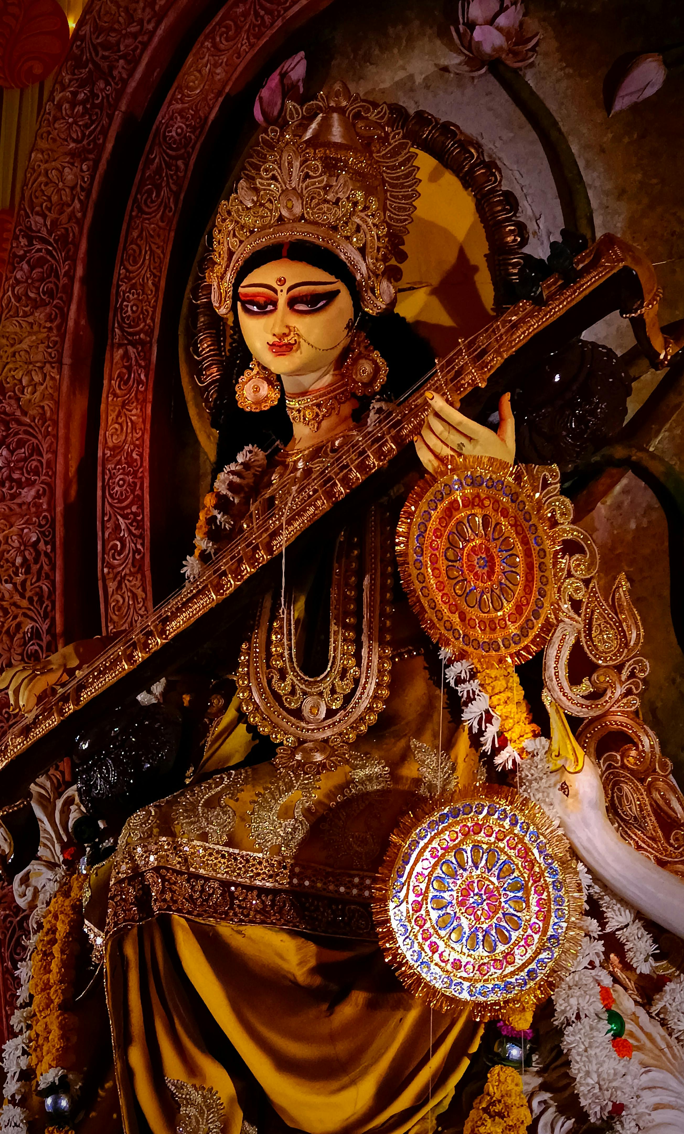 Intricate Statue of Goddess Saraswati with Veena · Free Stock Photo