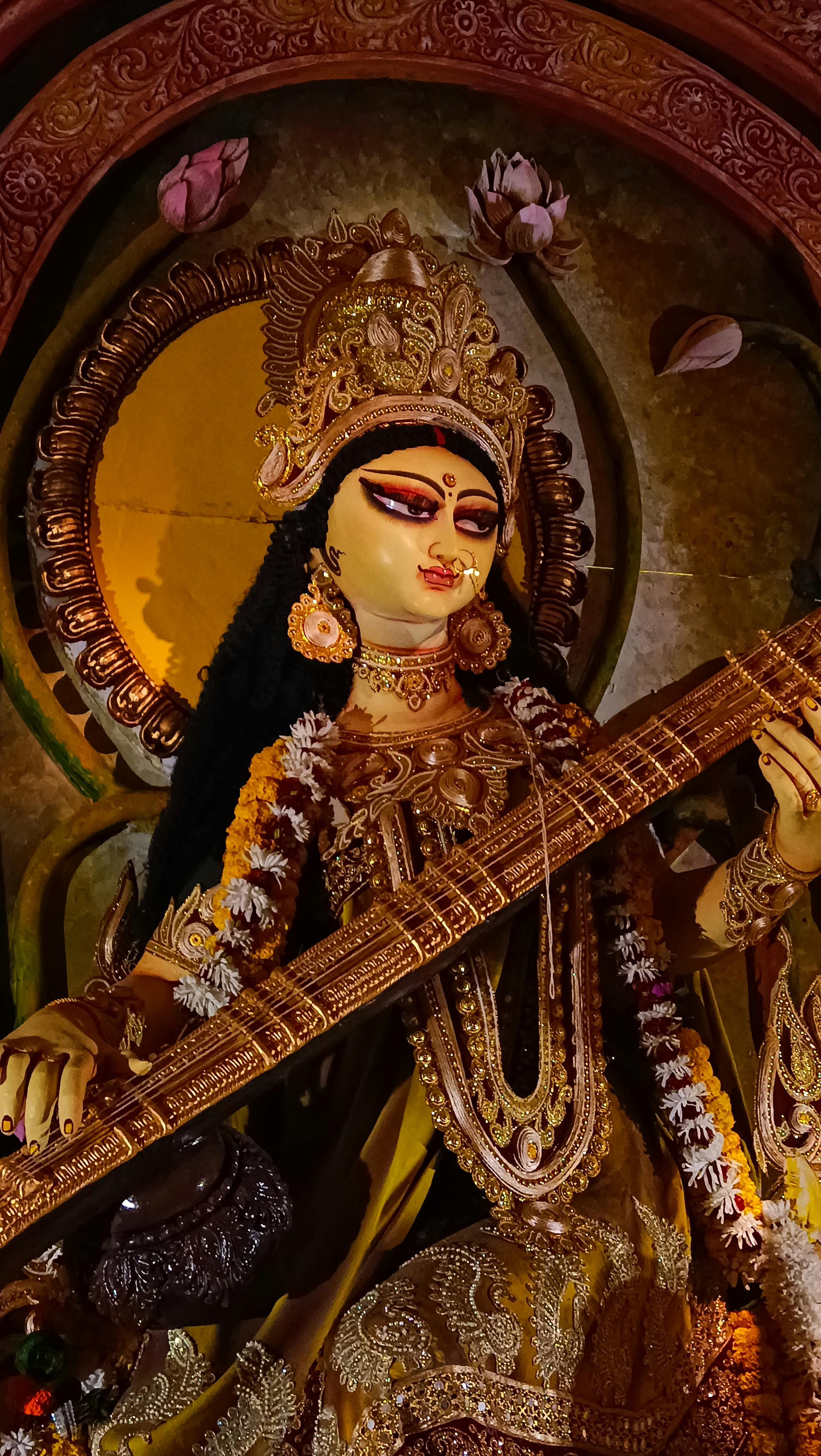 Intricate Statue of Goddess Saraswati with Veena · Free Stock Photo
