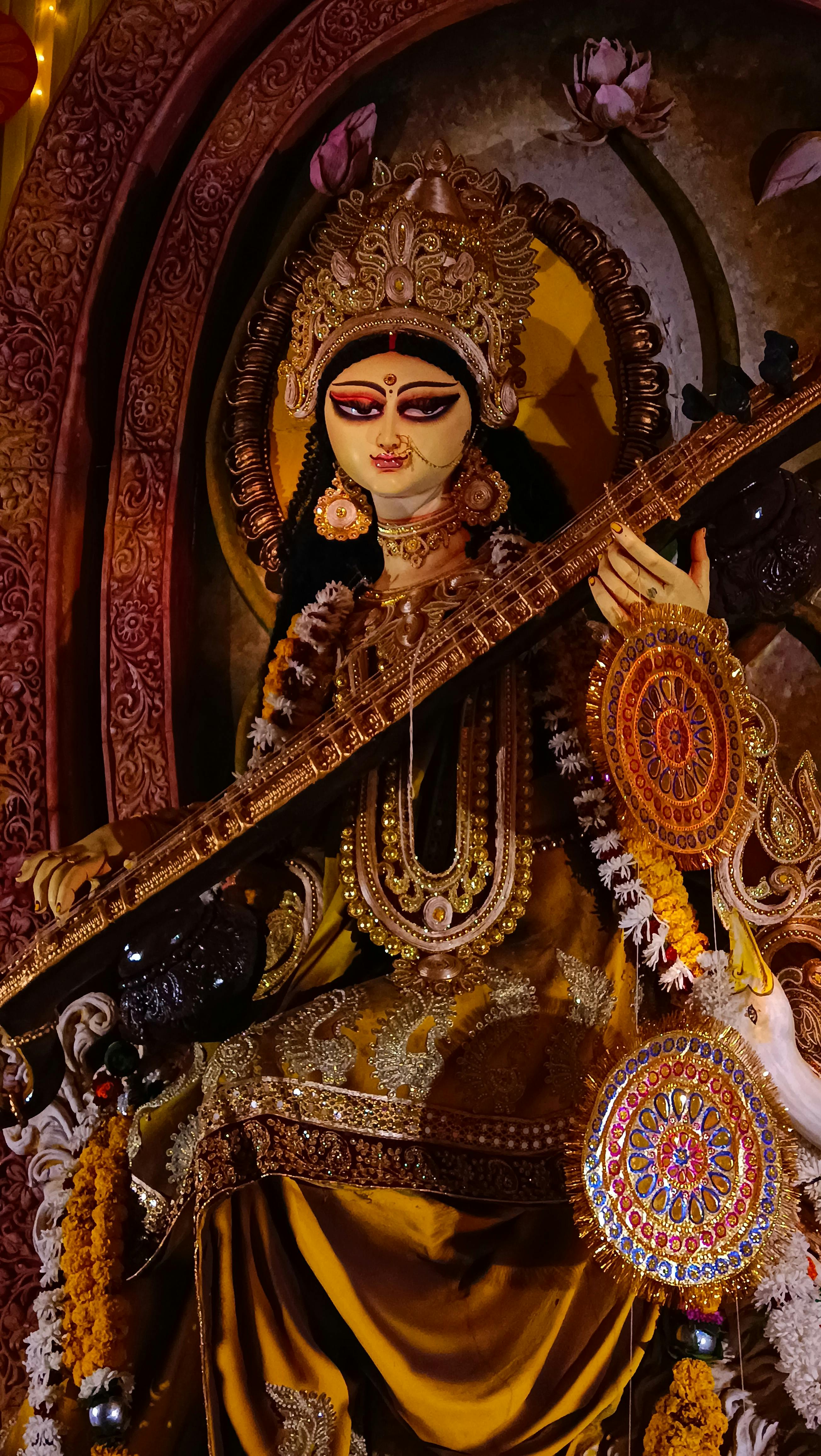 Intricate Statue of Goddess Saraswati with Veena · Free Stock Photo
