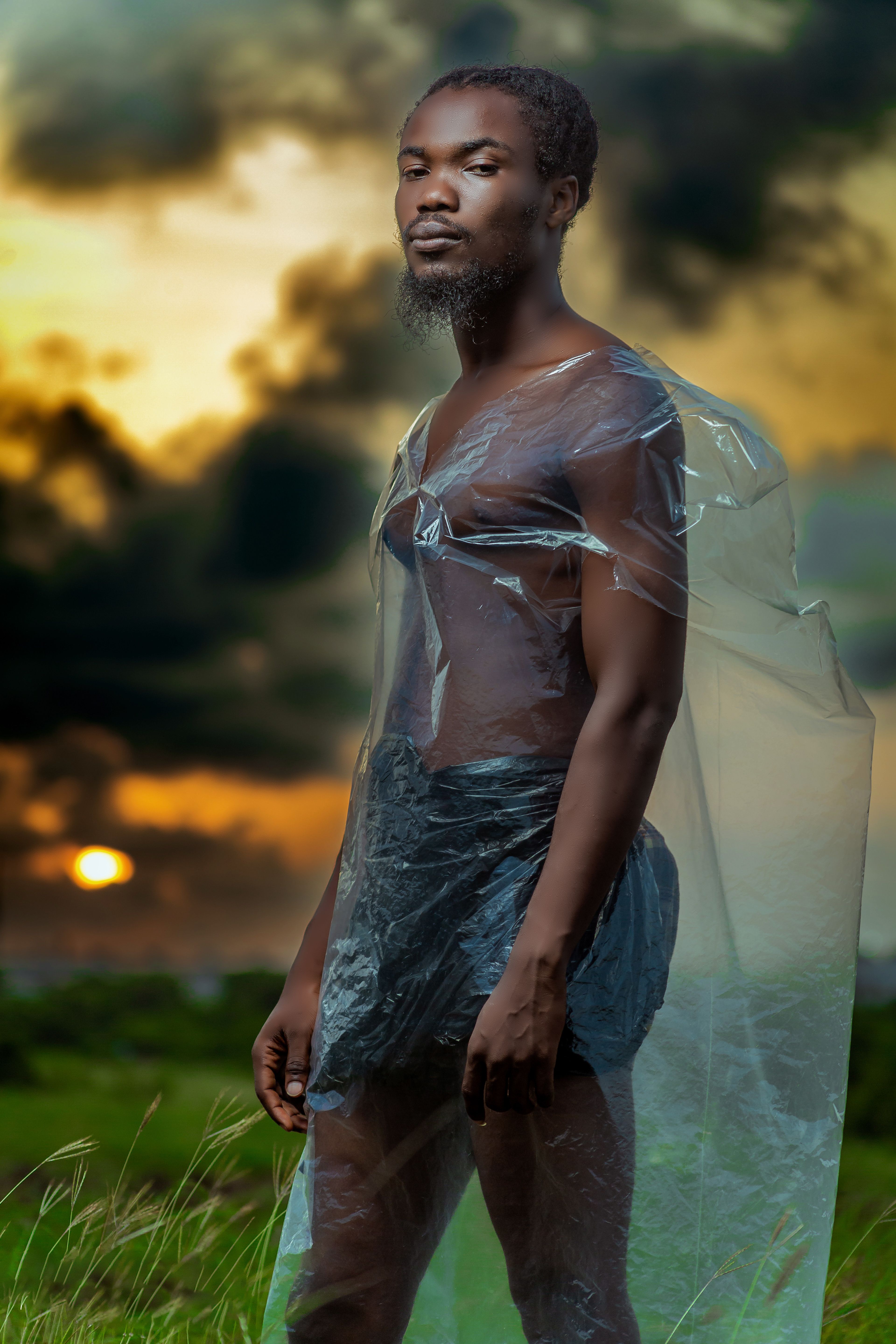 Portrait of Man in Plastic Wrap at Sunset · Free Stock Photo