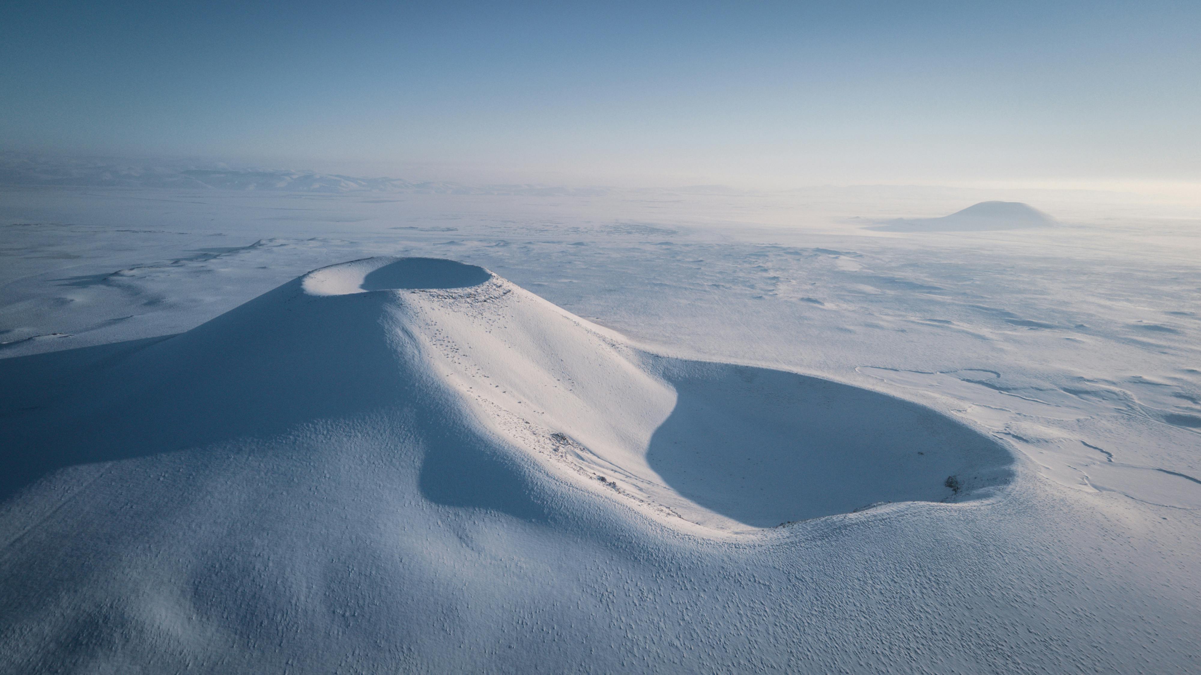 Stunning Aerial View of Snow-Covered Volcanic Crater · Free Stock Photo