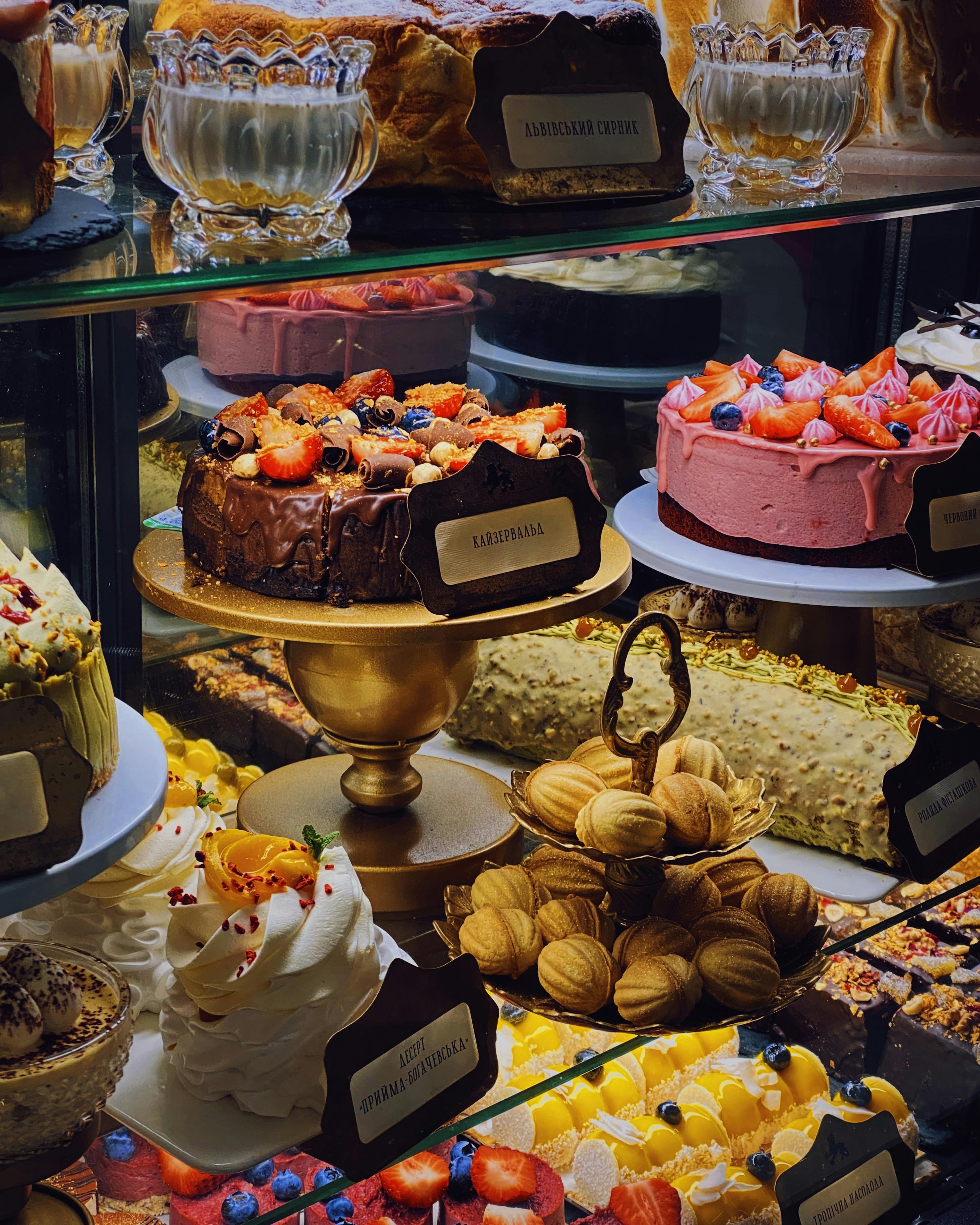 Assorted Pastry Display in Bakery Showcase · Free Stock Photo