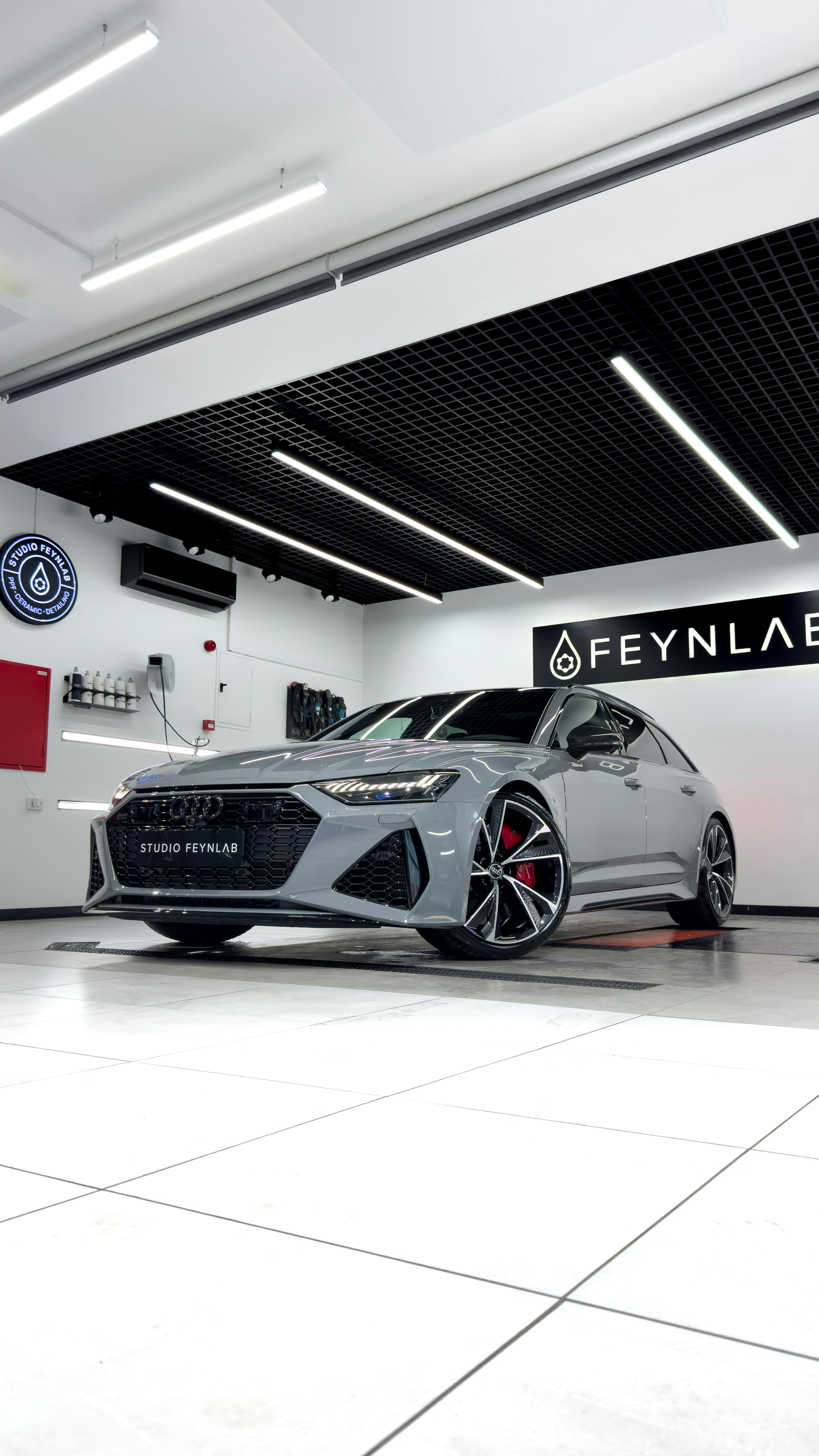 Sleek Gray Luxury Car in Modern Showroom · Free Stock Photo