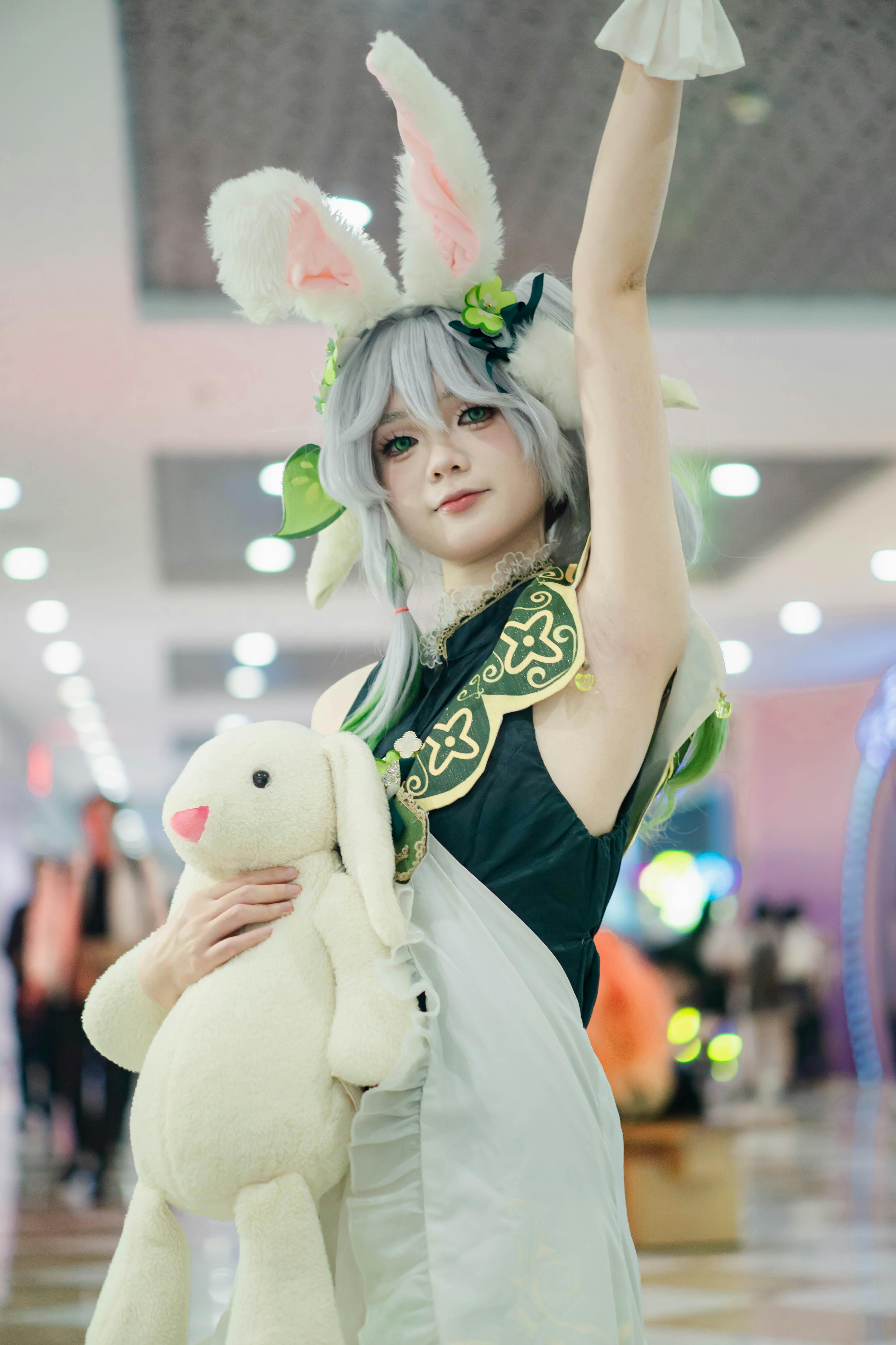 Cosplay Enthusiast with Rabbit Plush Toy · Free Stock Photo