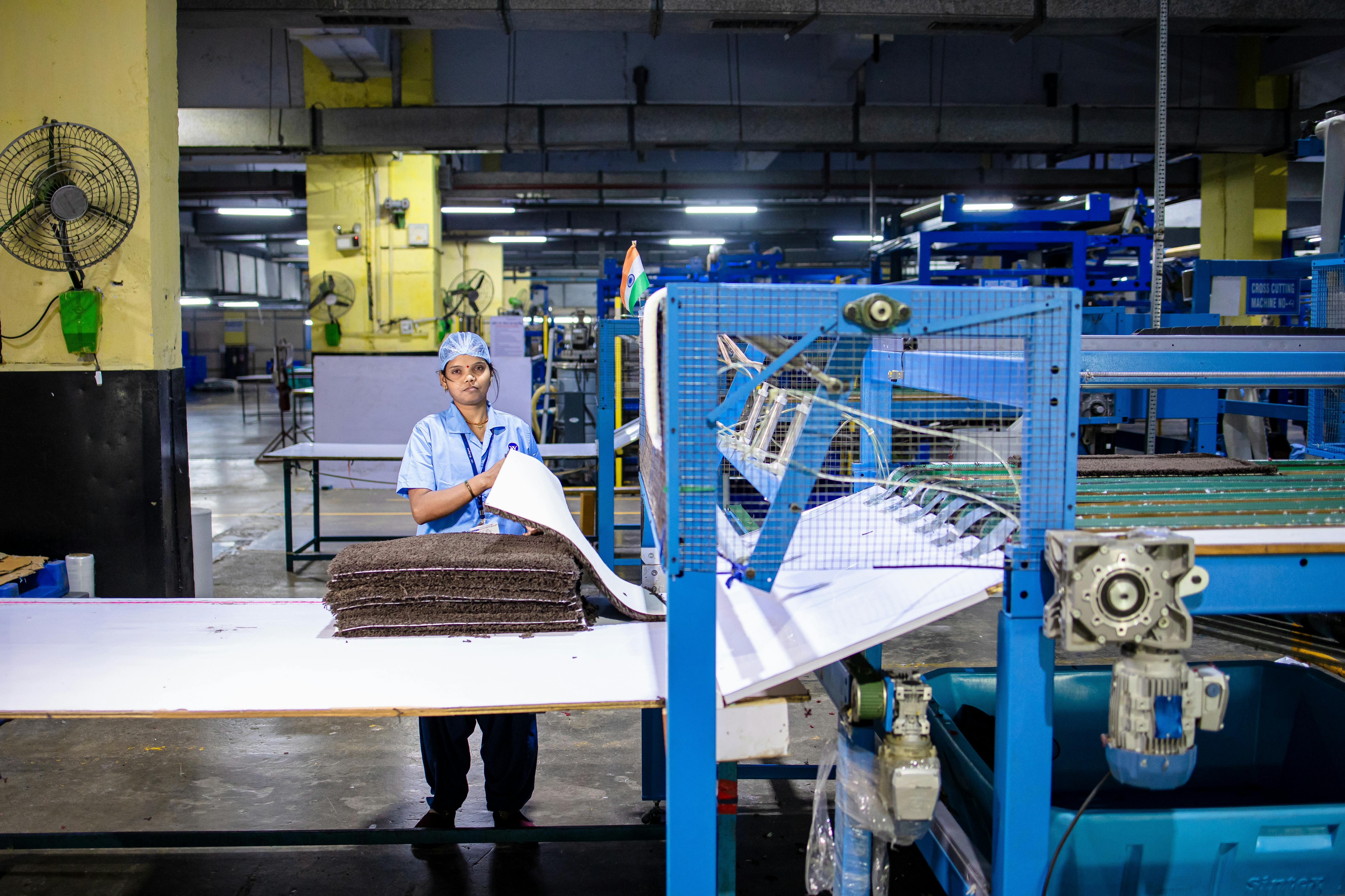 Female Textile Worker in a Modern Factory · Free Stock Photo