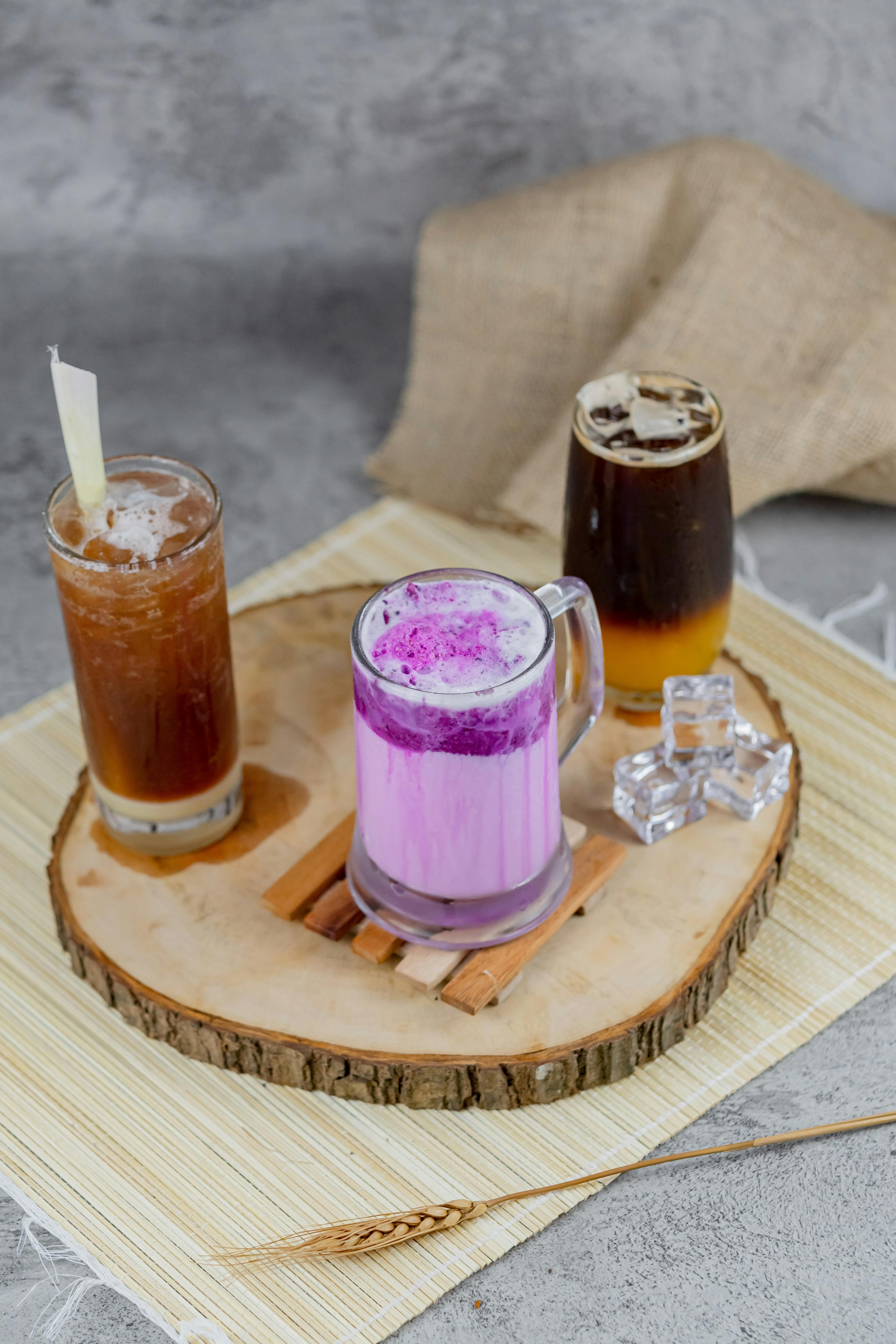 Assorted Beverages on Rustic Wooden Surface · Free Stock Photo