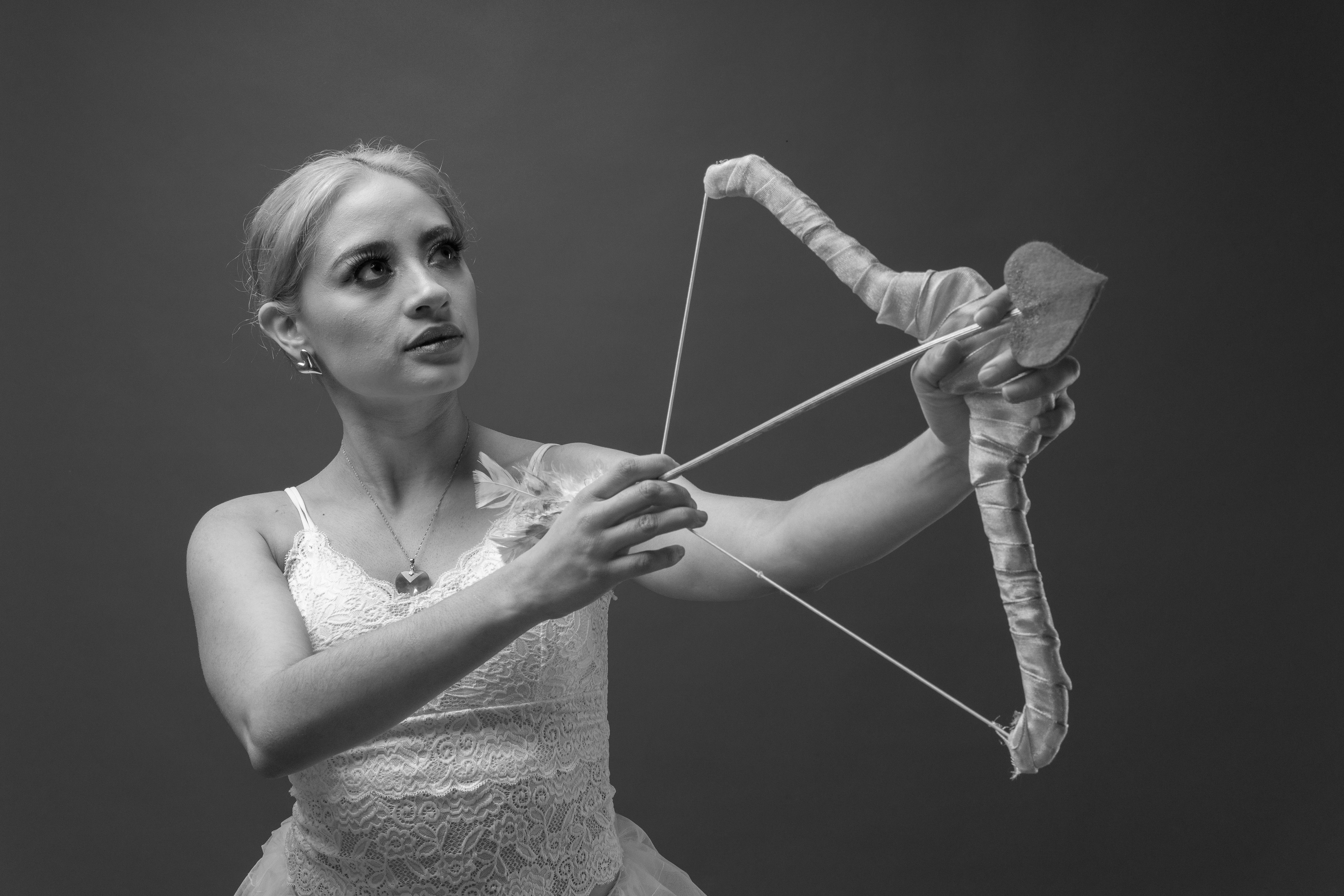 Elegant Ballerina Portraying Cupid in Motion · Free Stock Photo