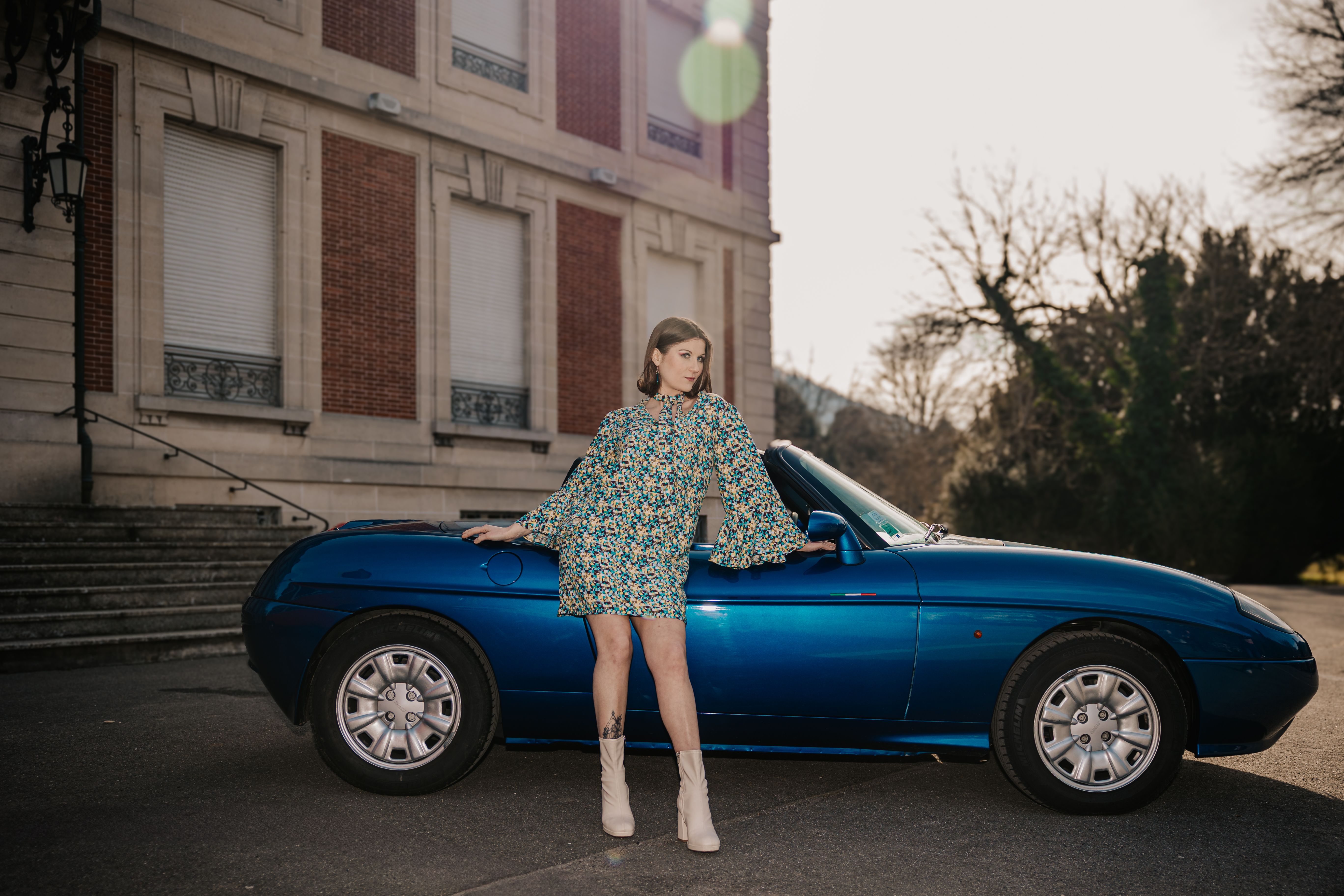 Stylish Woman Posing with Blue Convertible Car · Free Stock Photo