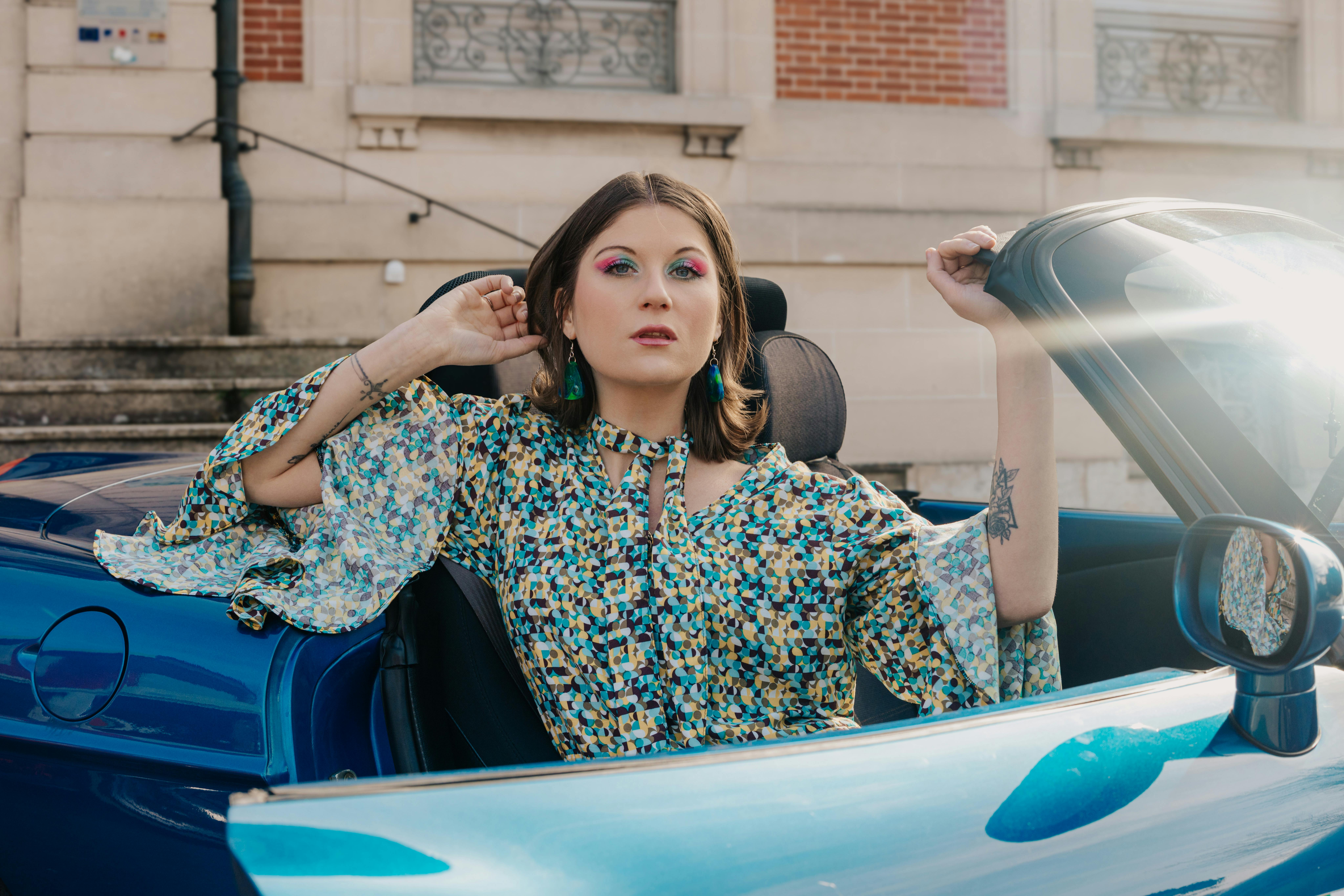 Fashionable Woman in Convertible on Sunny Day · Free Stock Photo