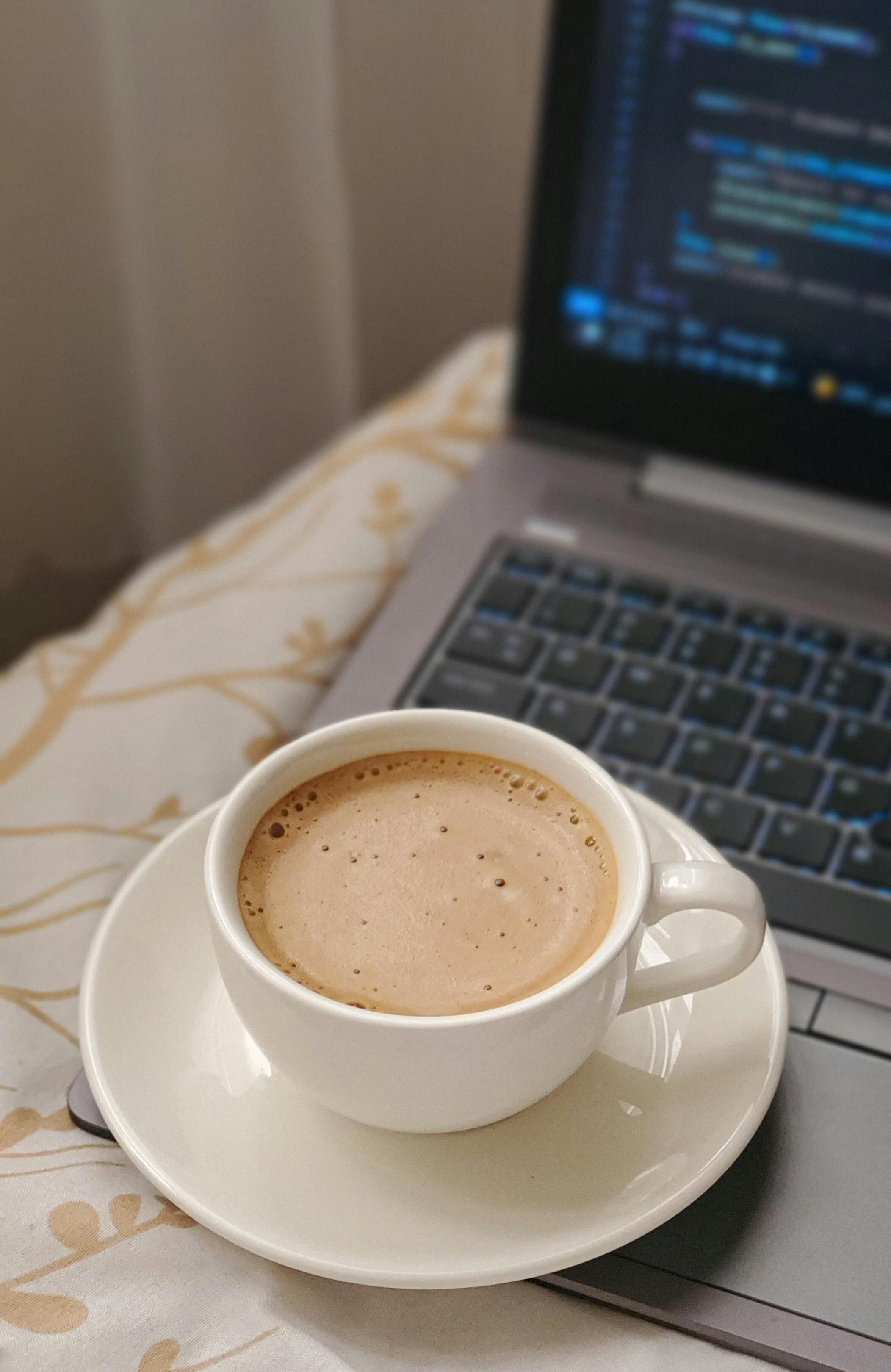Coffee on Laptop with Code Background · Free Stock Photo