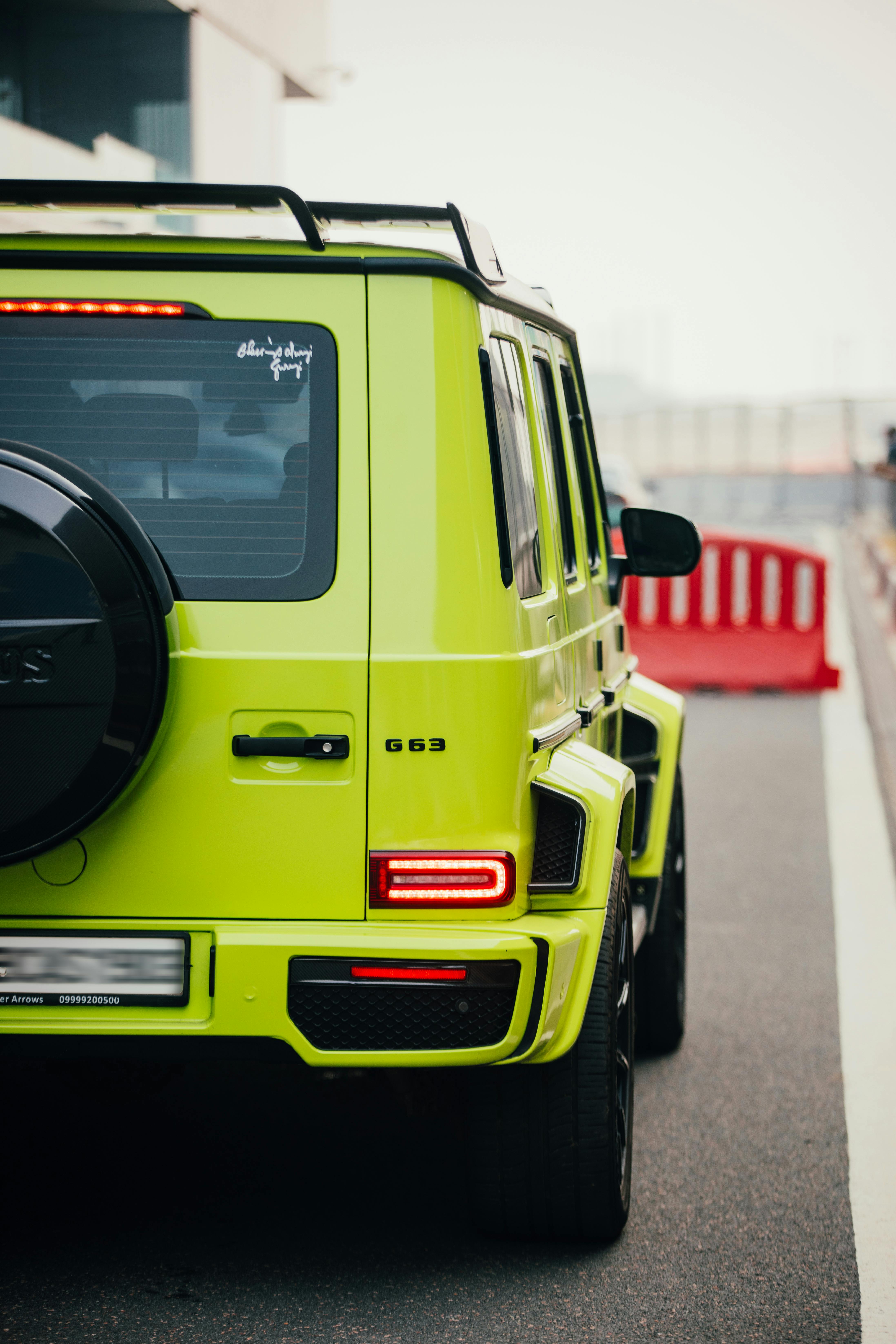 Lime Green SUV on Race Track in Greater Noida · Free Stock Photo