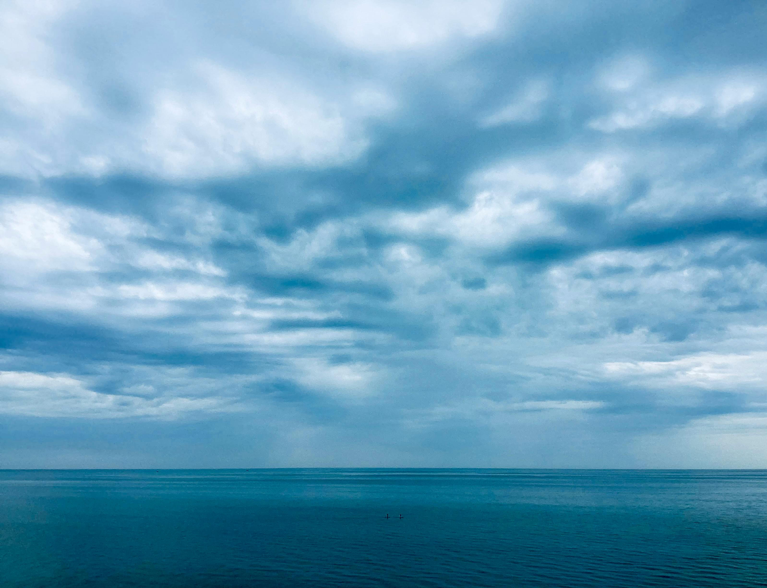 Tranquil Ocean View Under Dramatic Cloudy Sky · Free Stock Photo