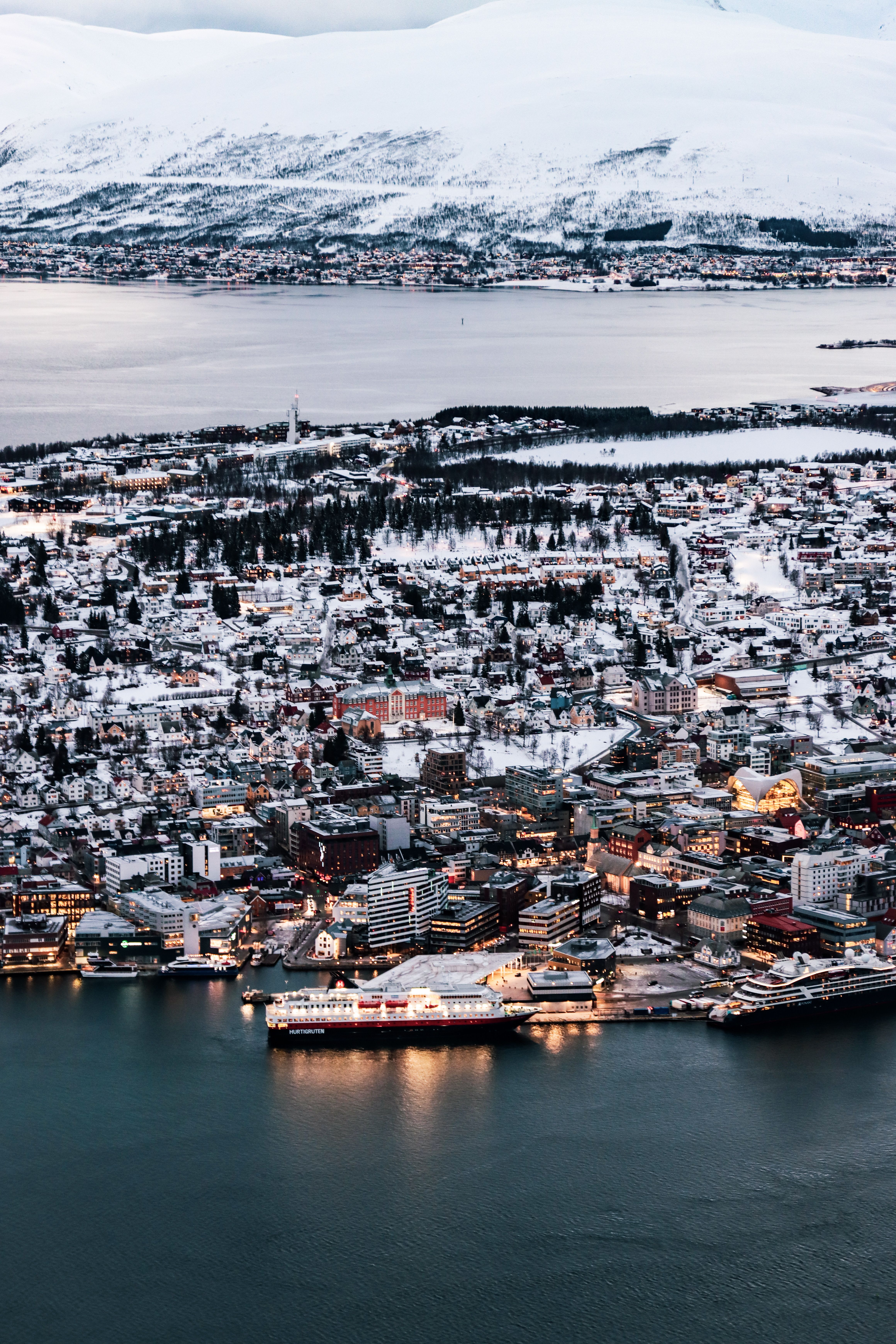 Aerial View of Snowy Tromsø Cityscape in Winter · Free Stock Photo