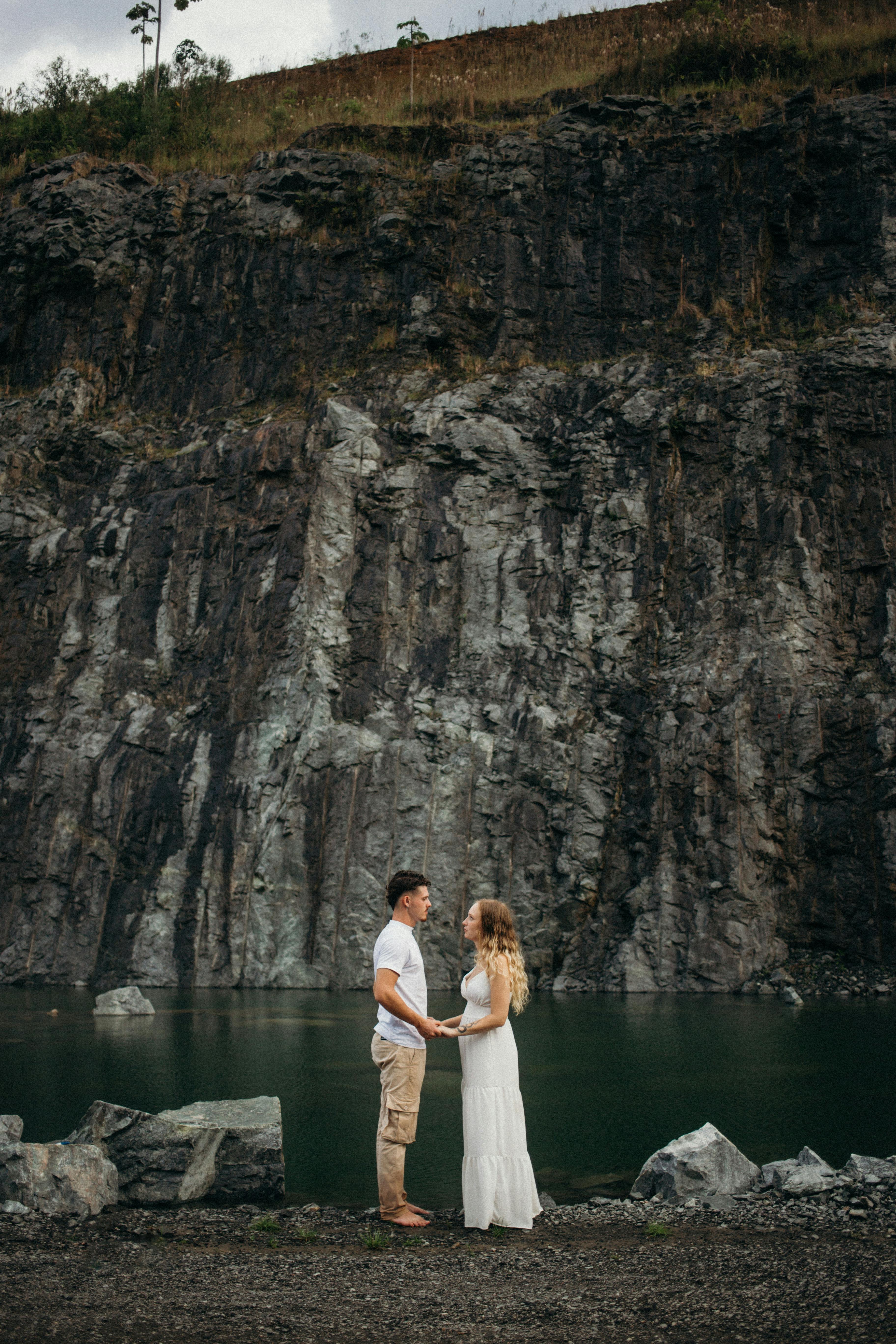 Romantic Couple by Rugged Brazilian Cliffside · Free Stock Photo