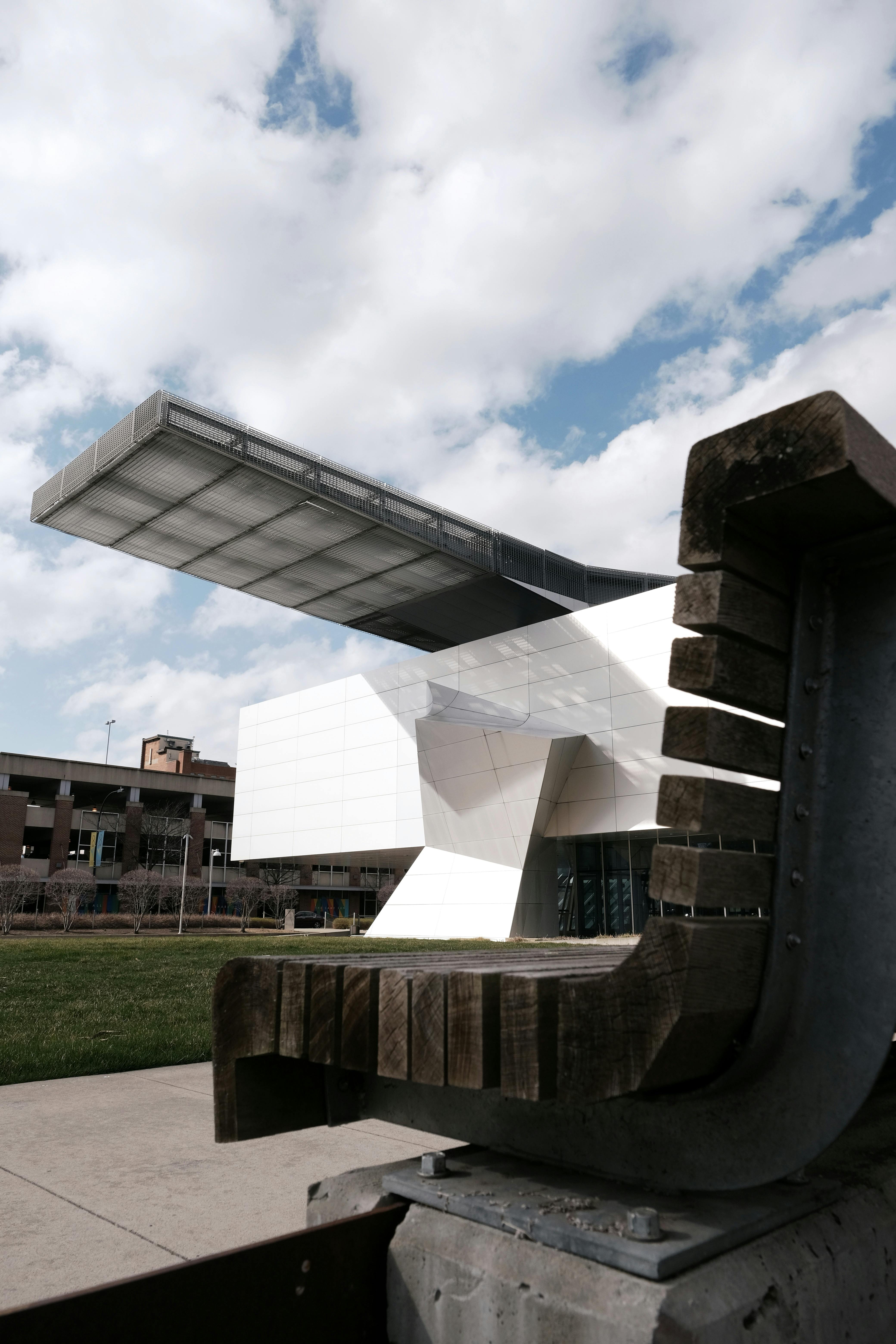 Modern Architectural Structure with Bench in Foreground · Free Stock Photo