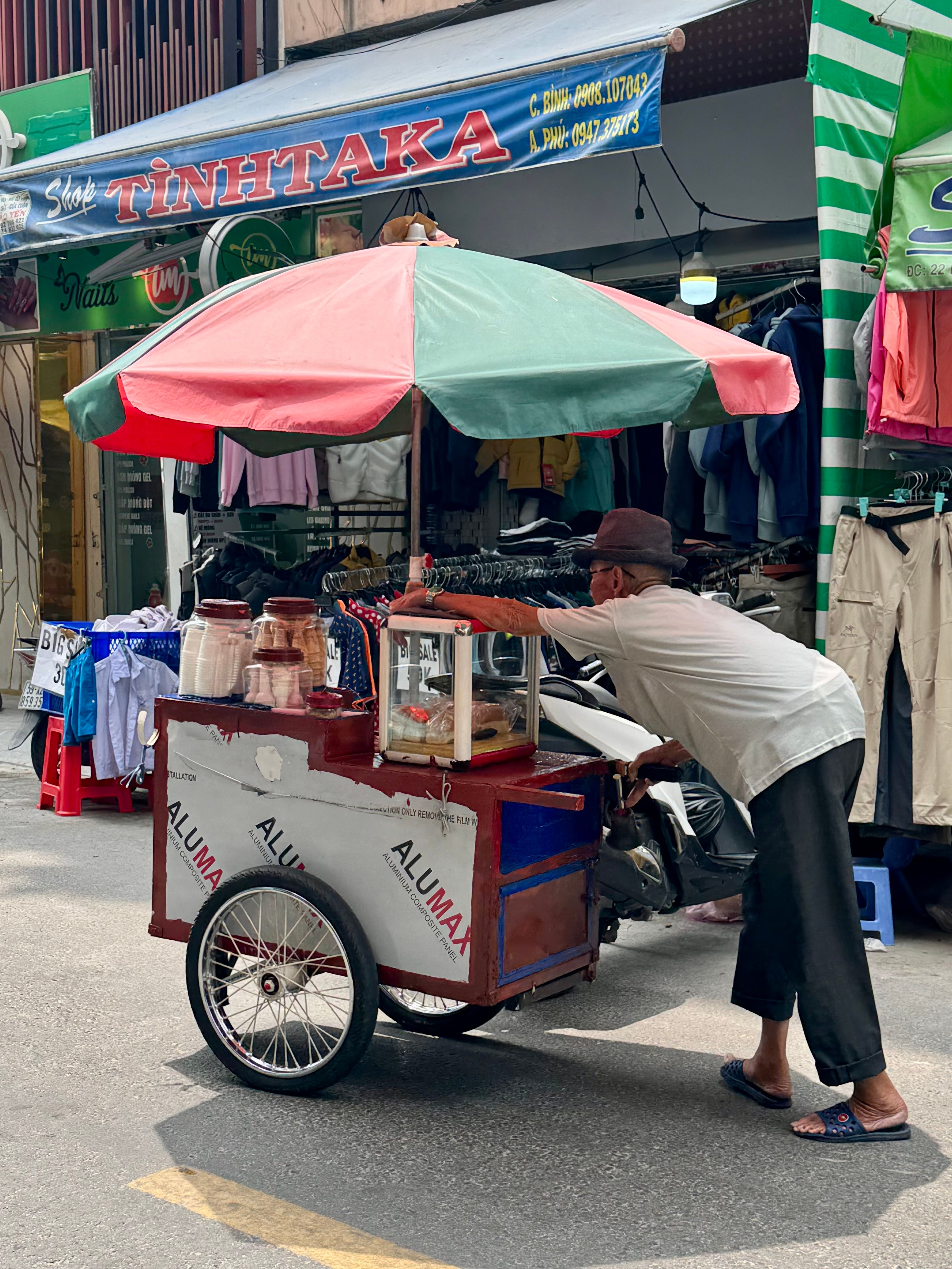 Street Vendor Selling Snacks in Market · Free Stock Photo