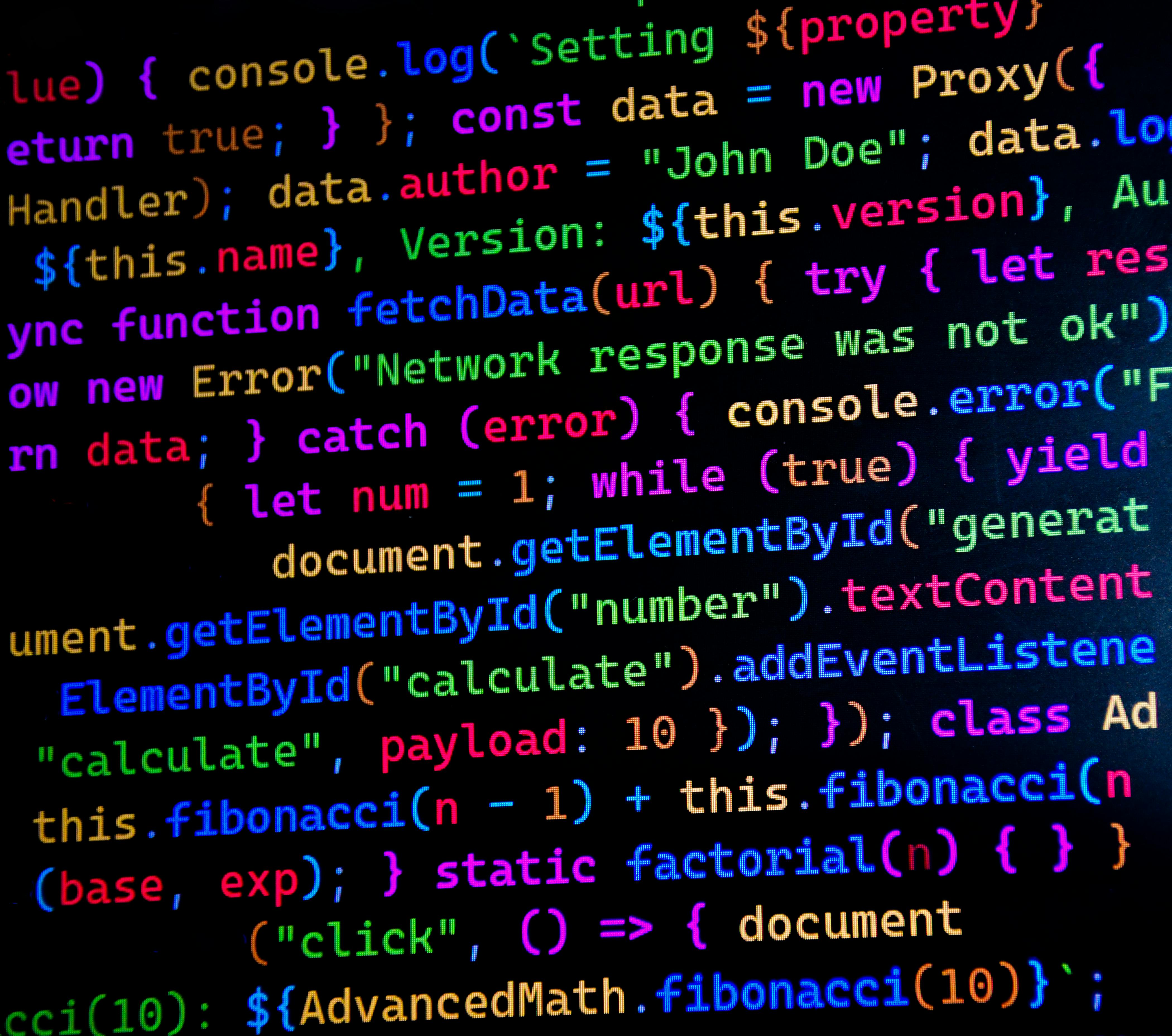 Colorful JavaScript Code on Monitor Screen · Free Stock Photo