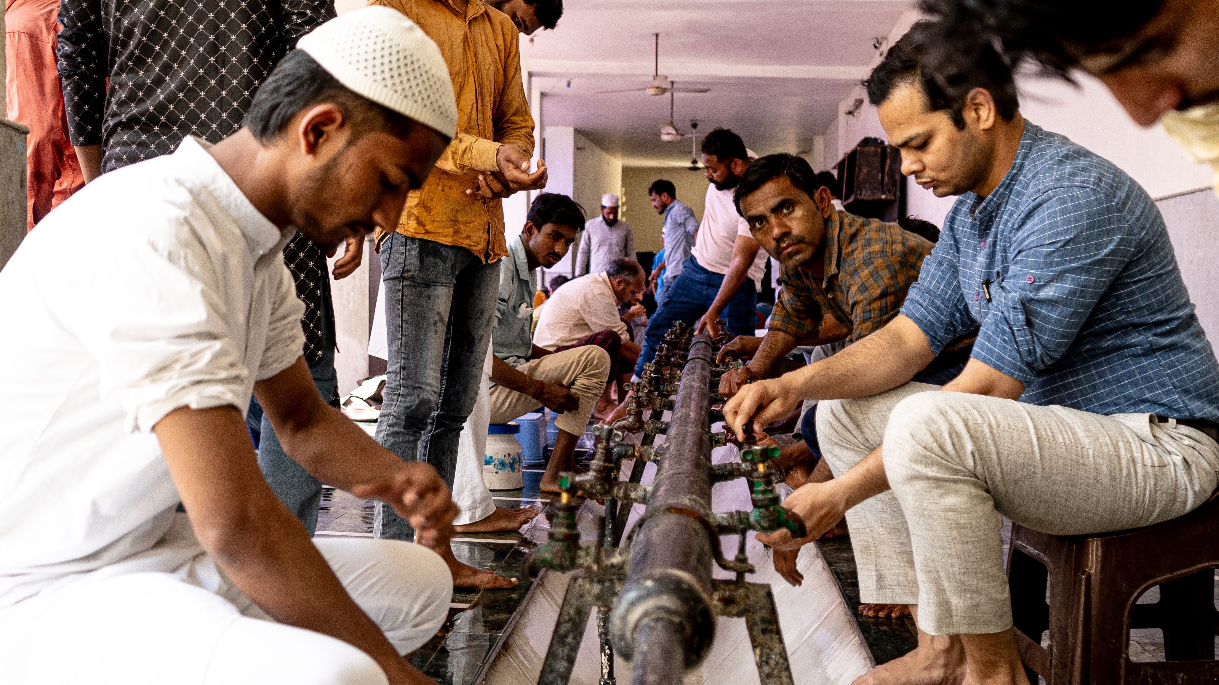 Men Performing Ritual Ablution in Mosque · Free Stock Photo