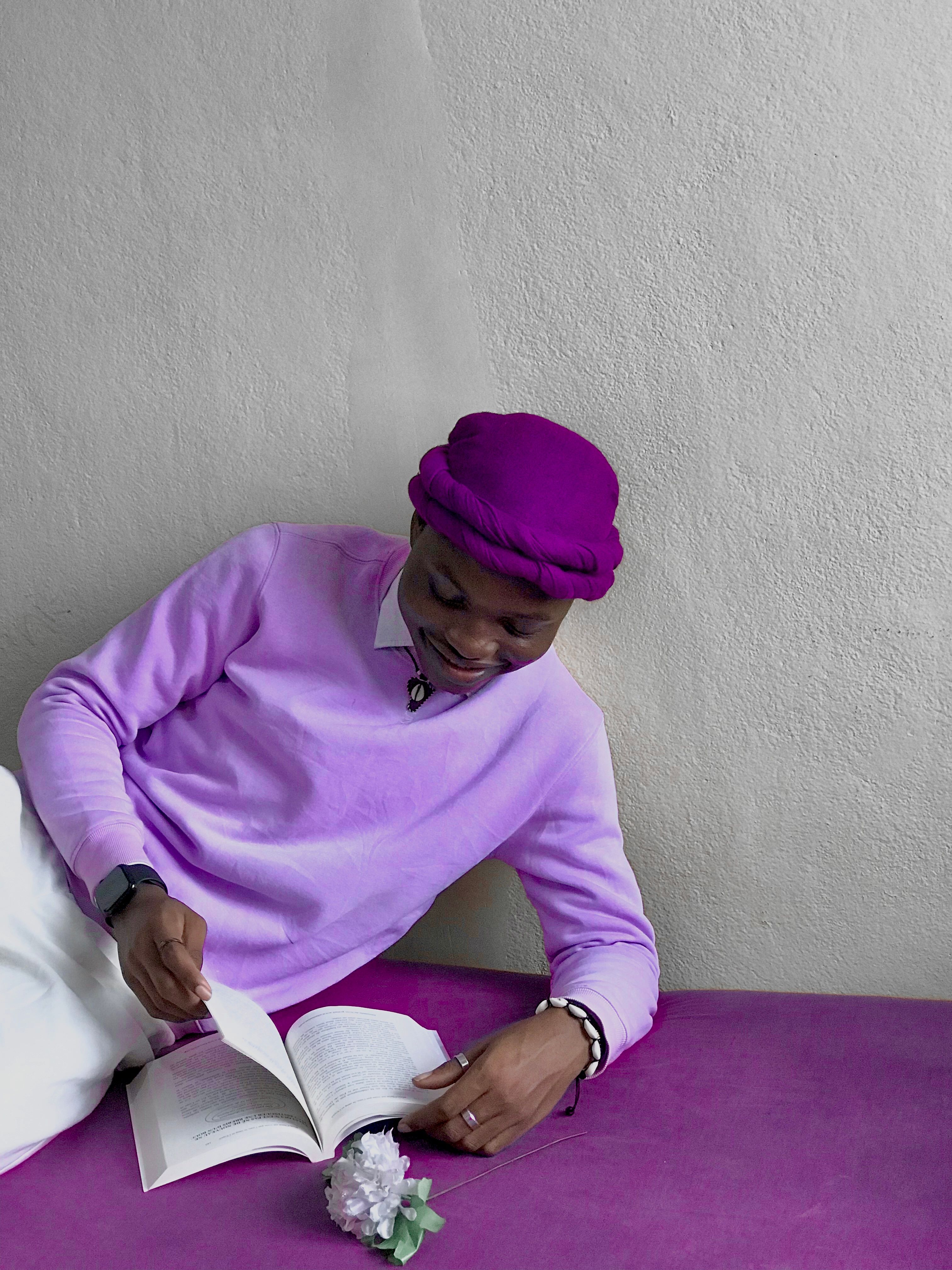 Relaxed Reading in Purple Attire · Free Stock Photo