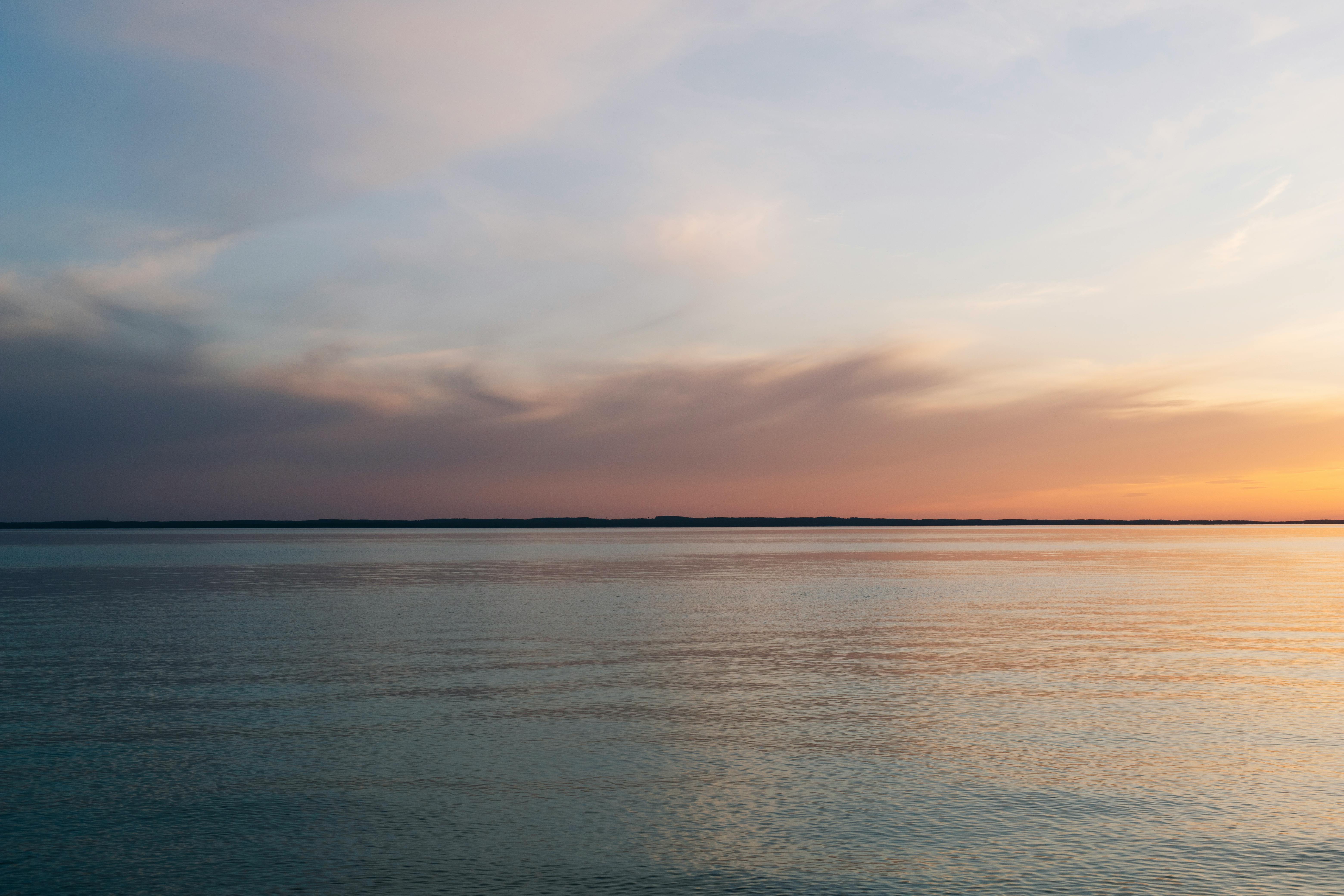 Serene Sunset Over Lake Michigan Waters · Free Stock Photo