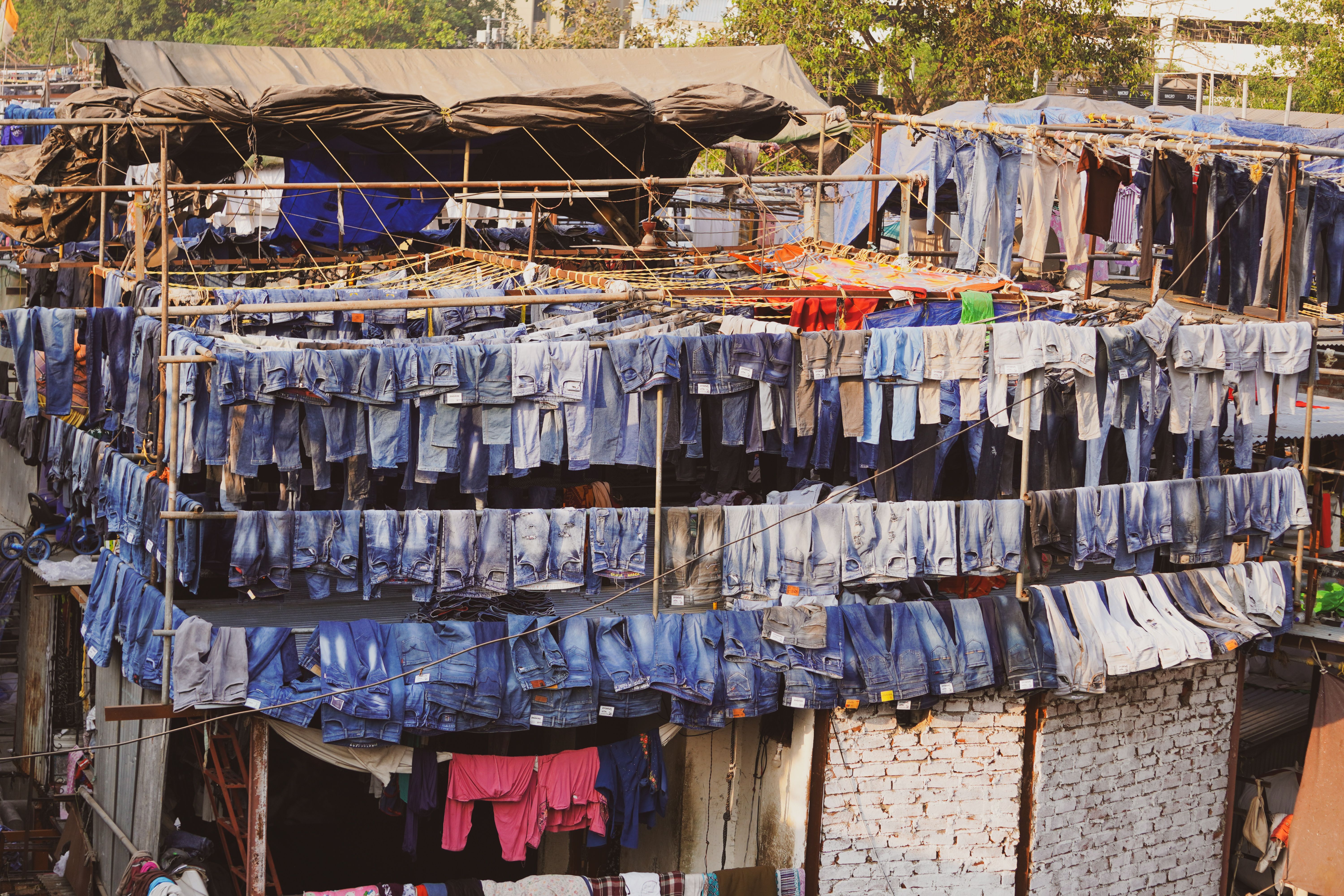 Mumbai Street Laundry Scene with Denim Clothes · Free Stock Photo