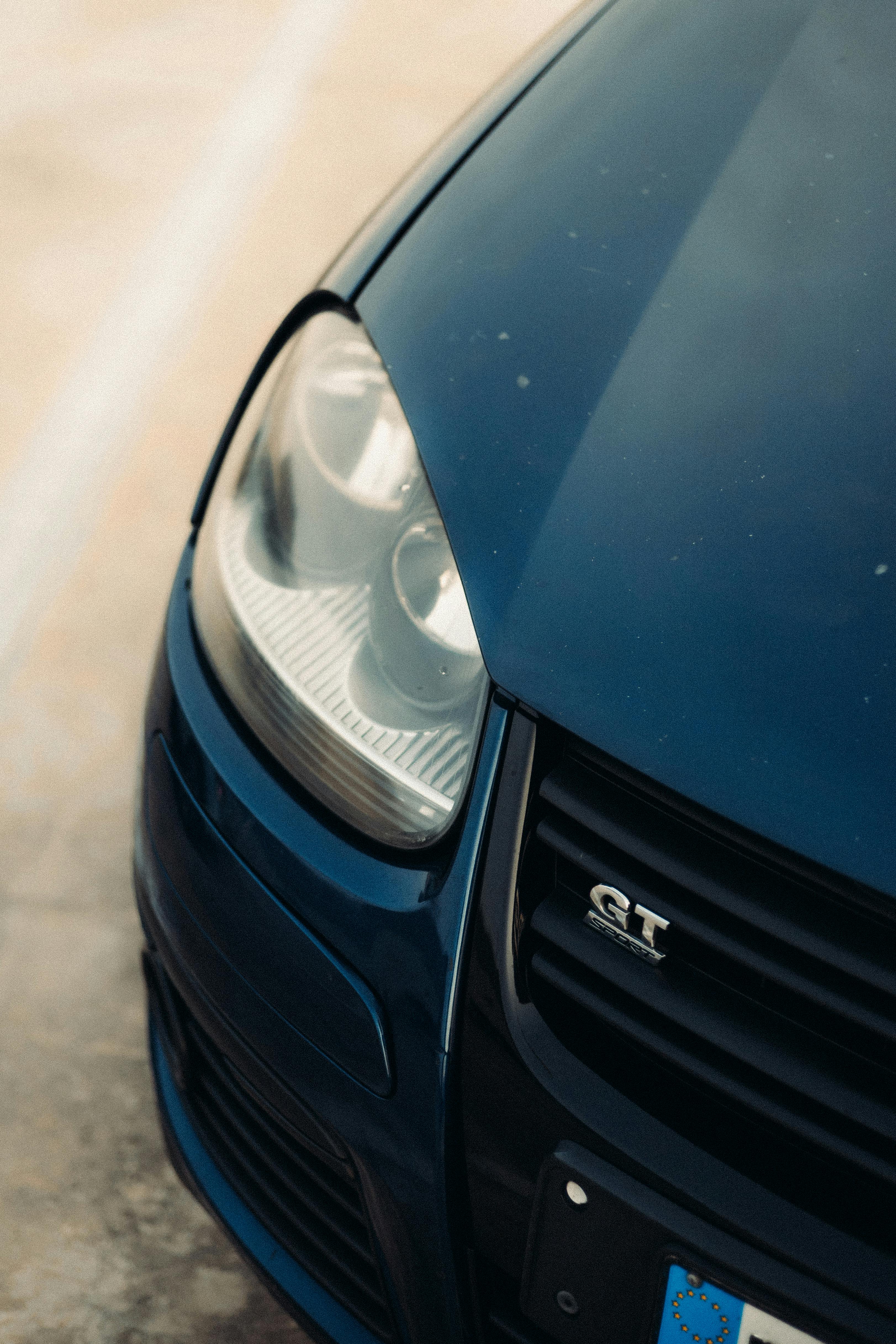 Close-up of Blue Car Front with GT Badge · Free Stock Photo