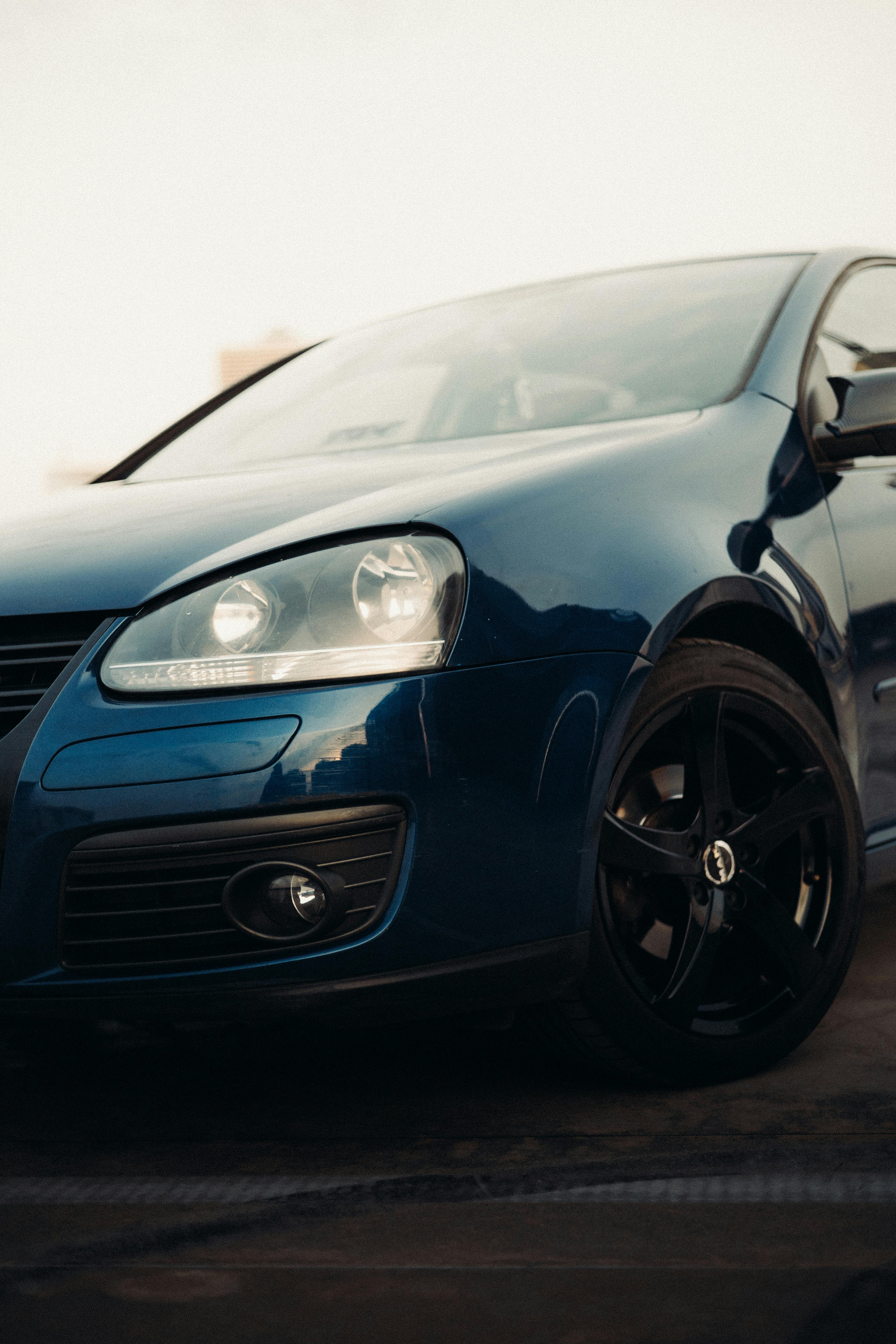 Close-up of Blue Car with Black Rims Outdoors · Free Stock Photo
