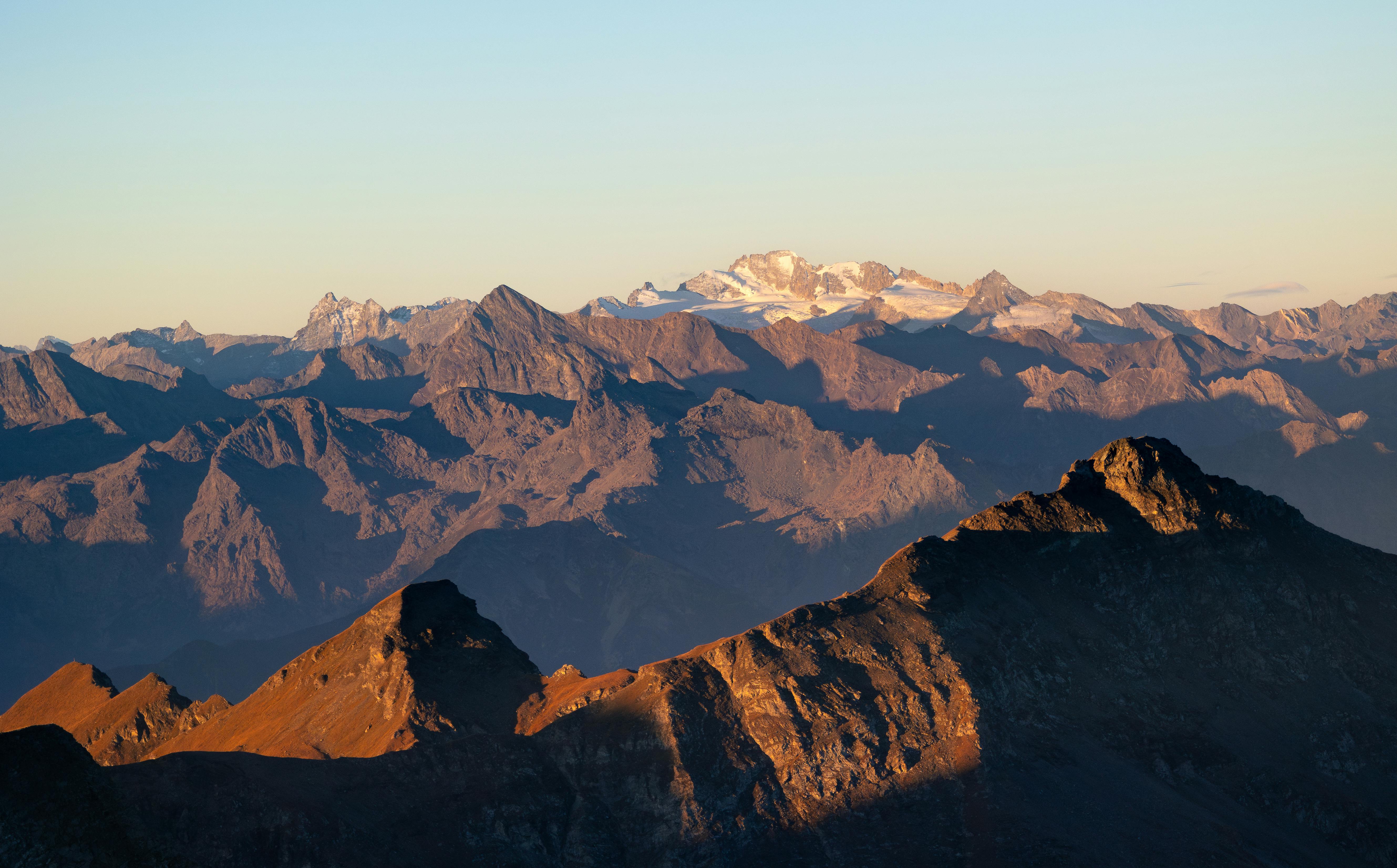 Breathtaking Alpine Sunrise Over Rugged Mountains · Free Stock Photo