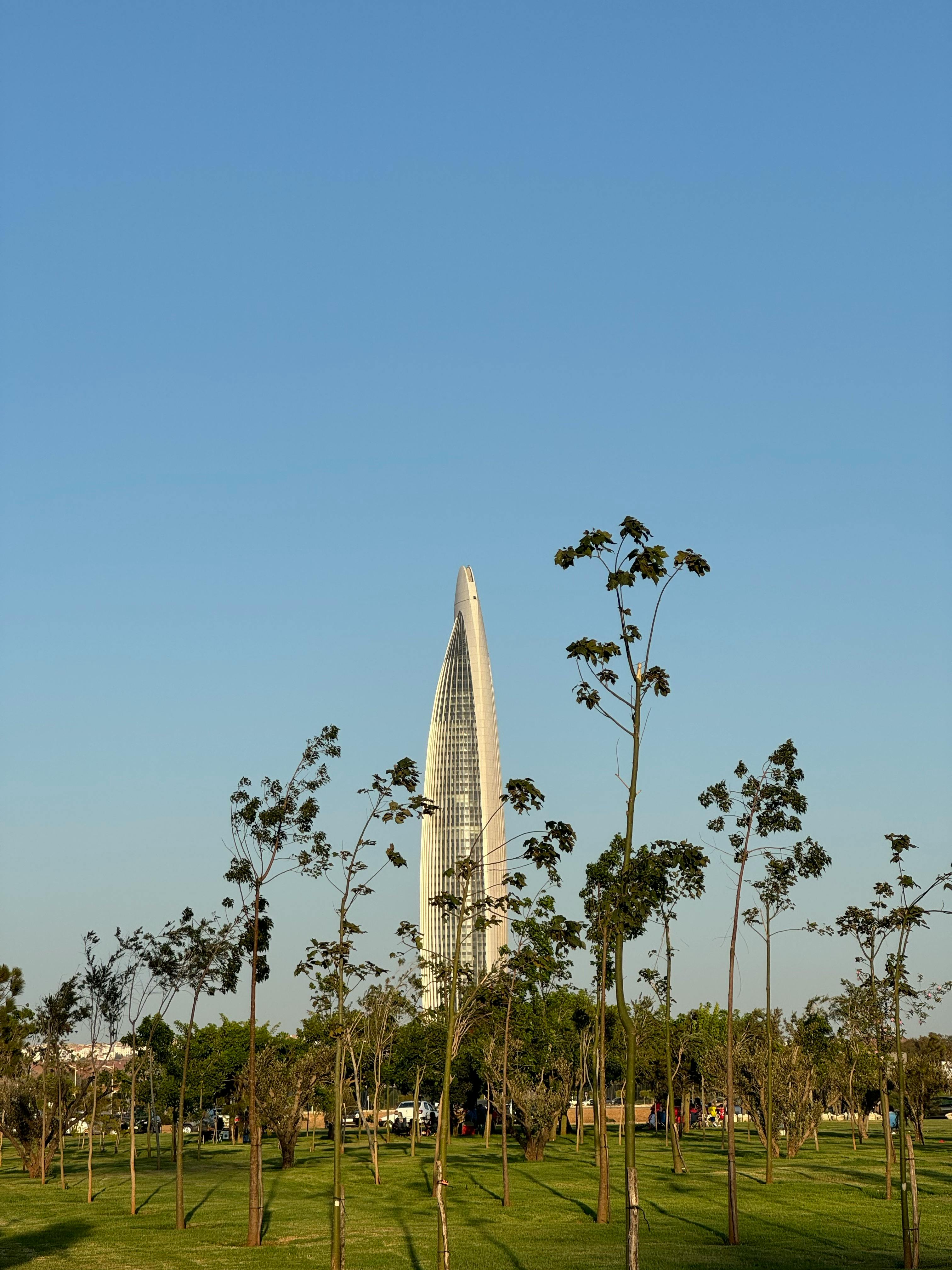 Iconic Skyscraper Amidst Greenery in Morocco · Free Stock Photo