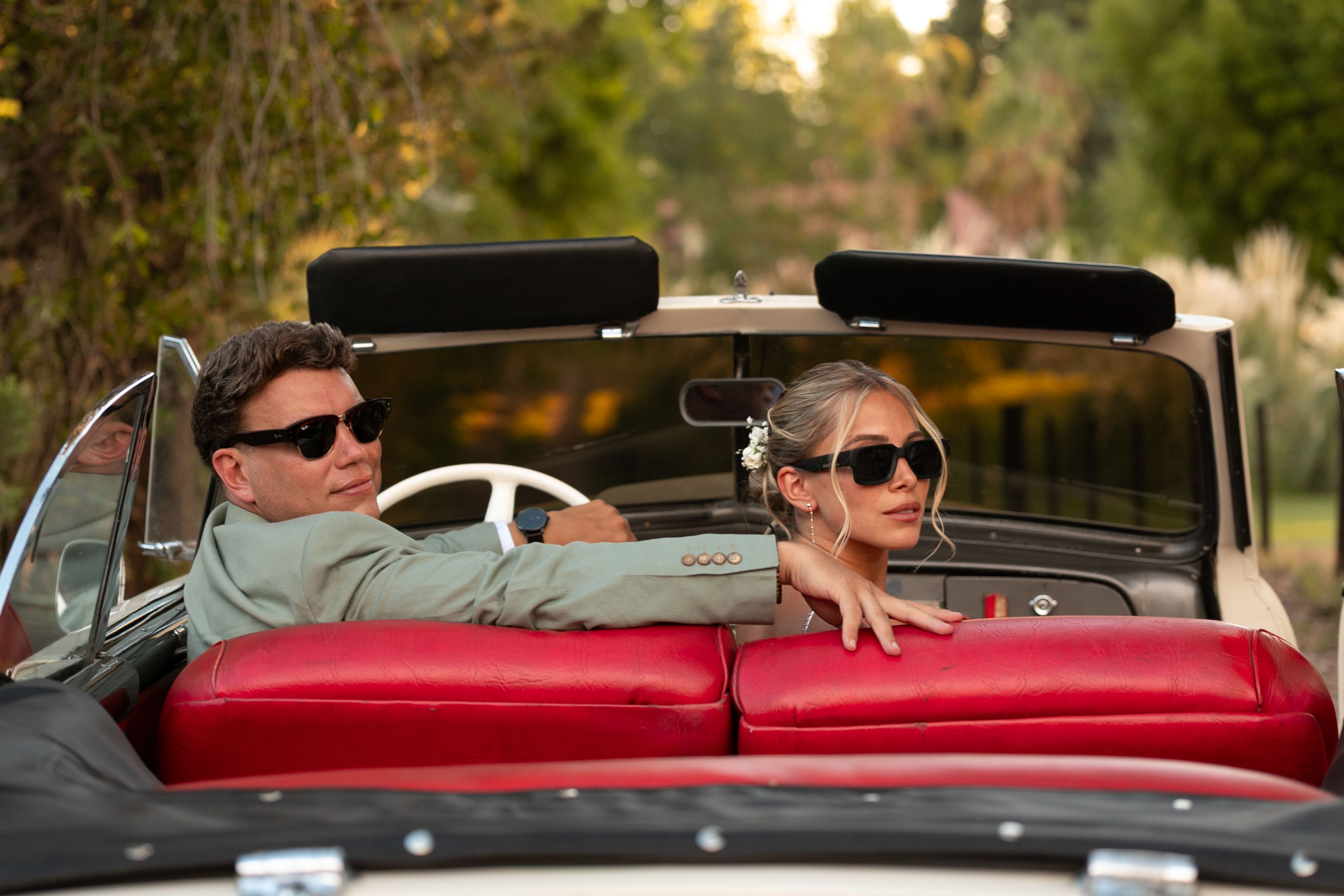Elegant Couple Enjoys Scenic Drive in Vintage Car · Free Stock Photo