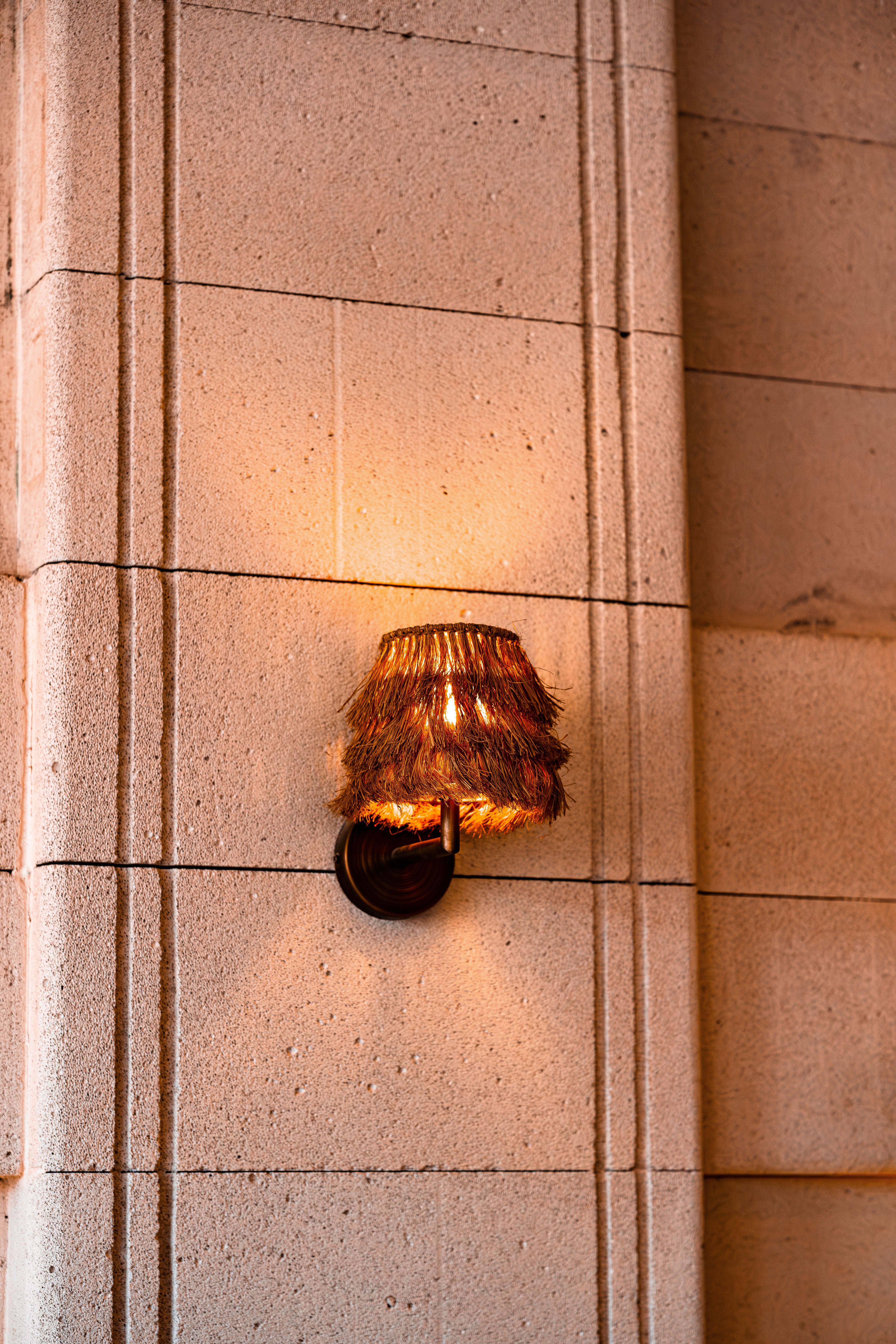 Rustic Wall Sconce Light on Stone Wall · Free Stock Photo