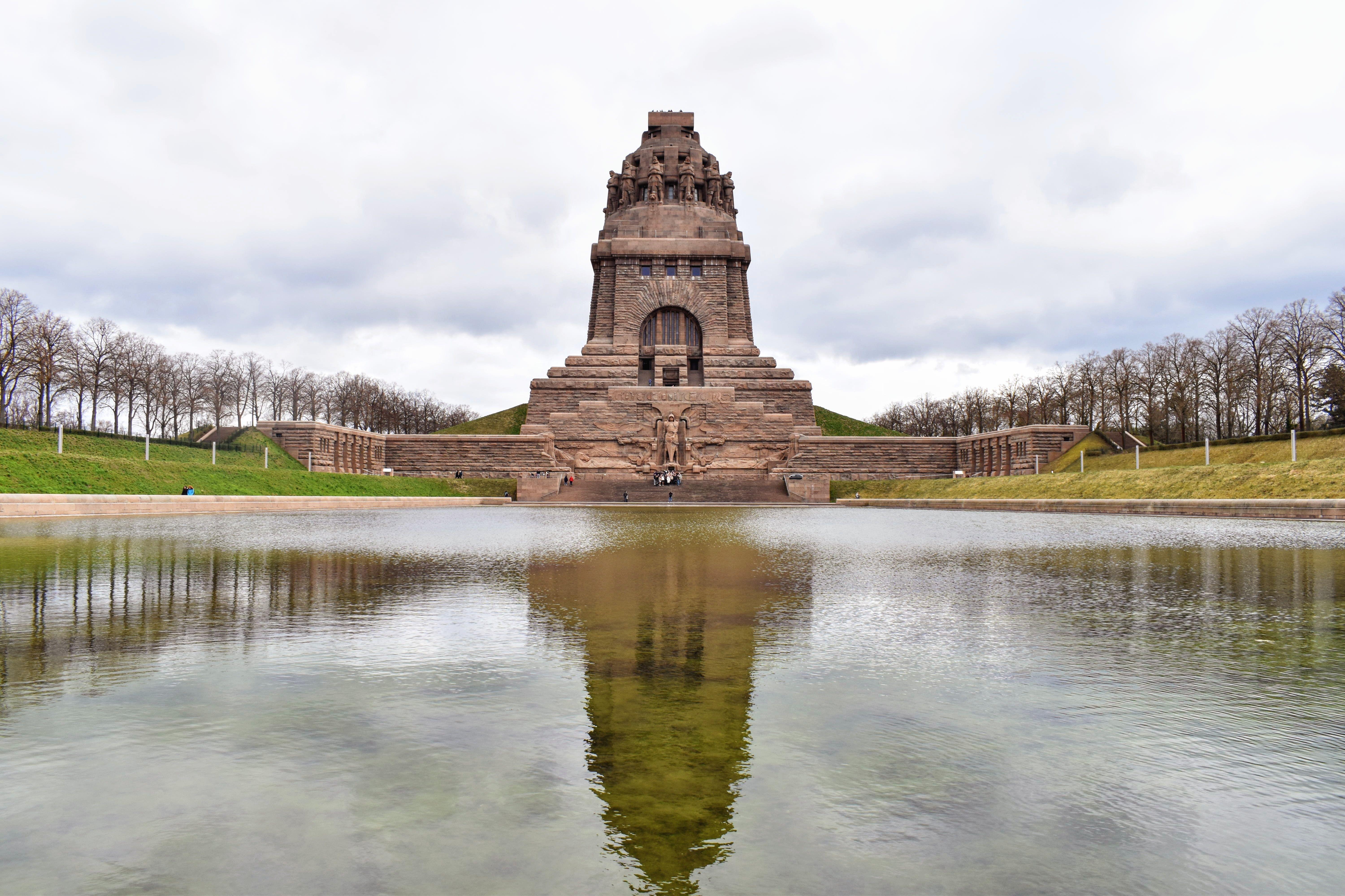 Monument Reflecting in Calm Water · Free Stock Photo