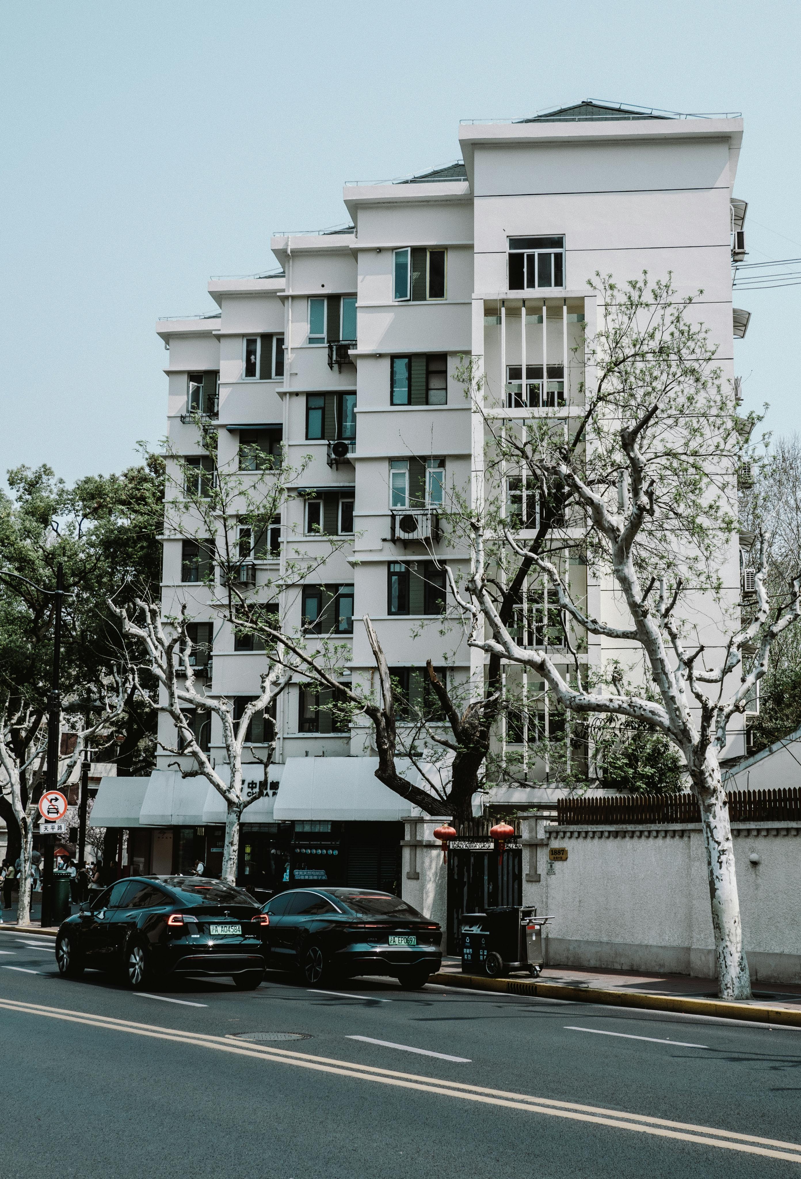 Urban Apartment Building in Springtime Setting · Free Stock Photo