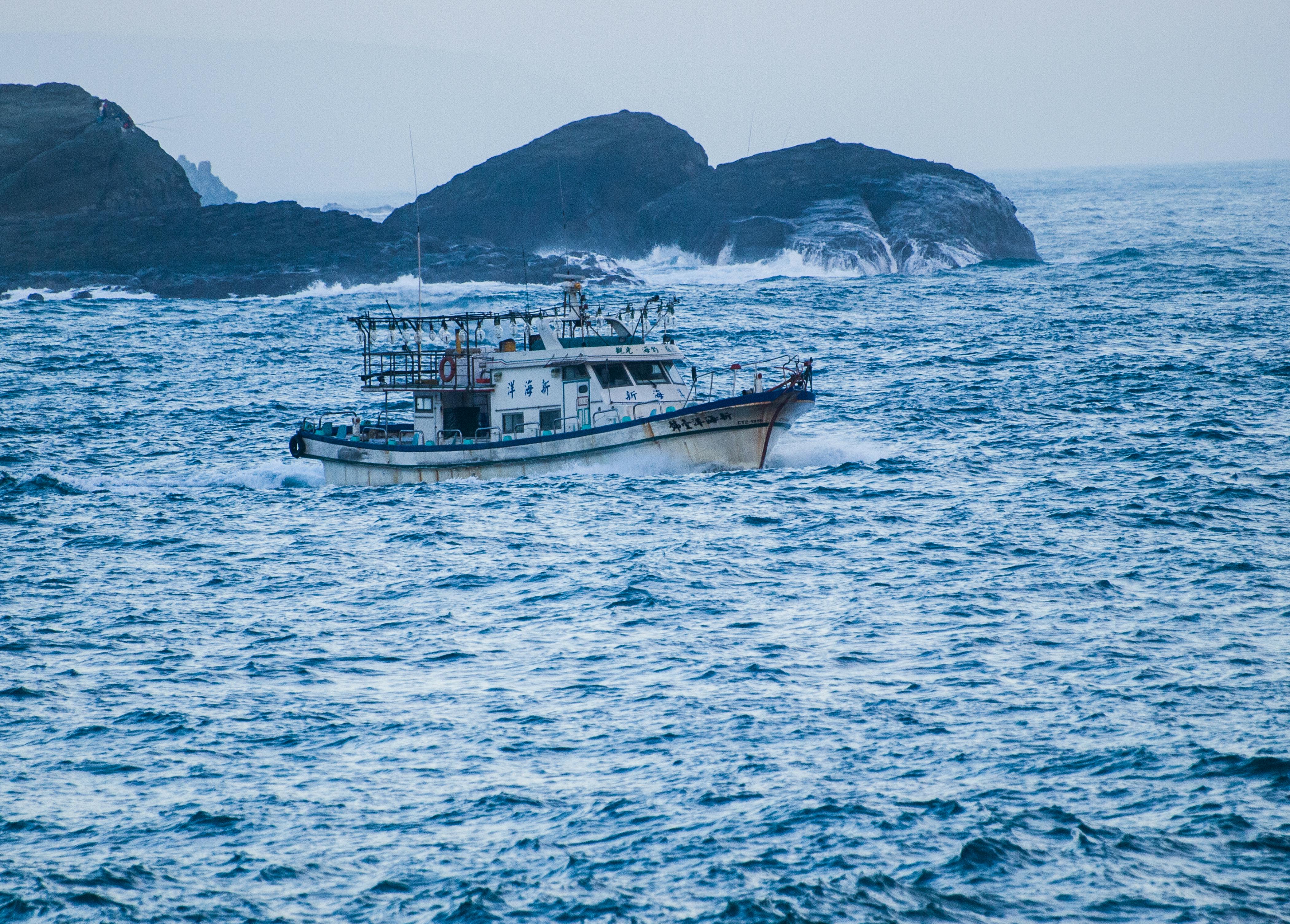 Fishing Boat Navigating the Taiwan Coastline · Free Stock Photo