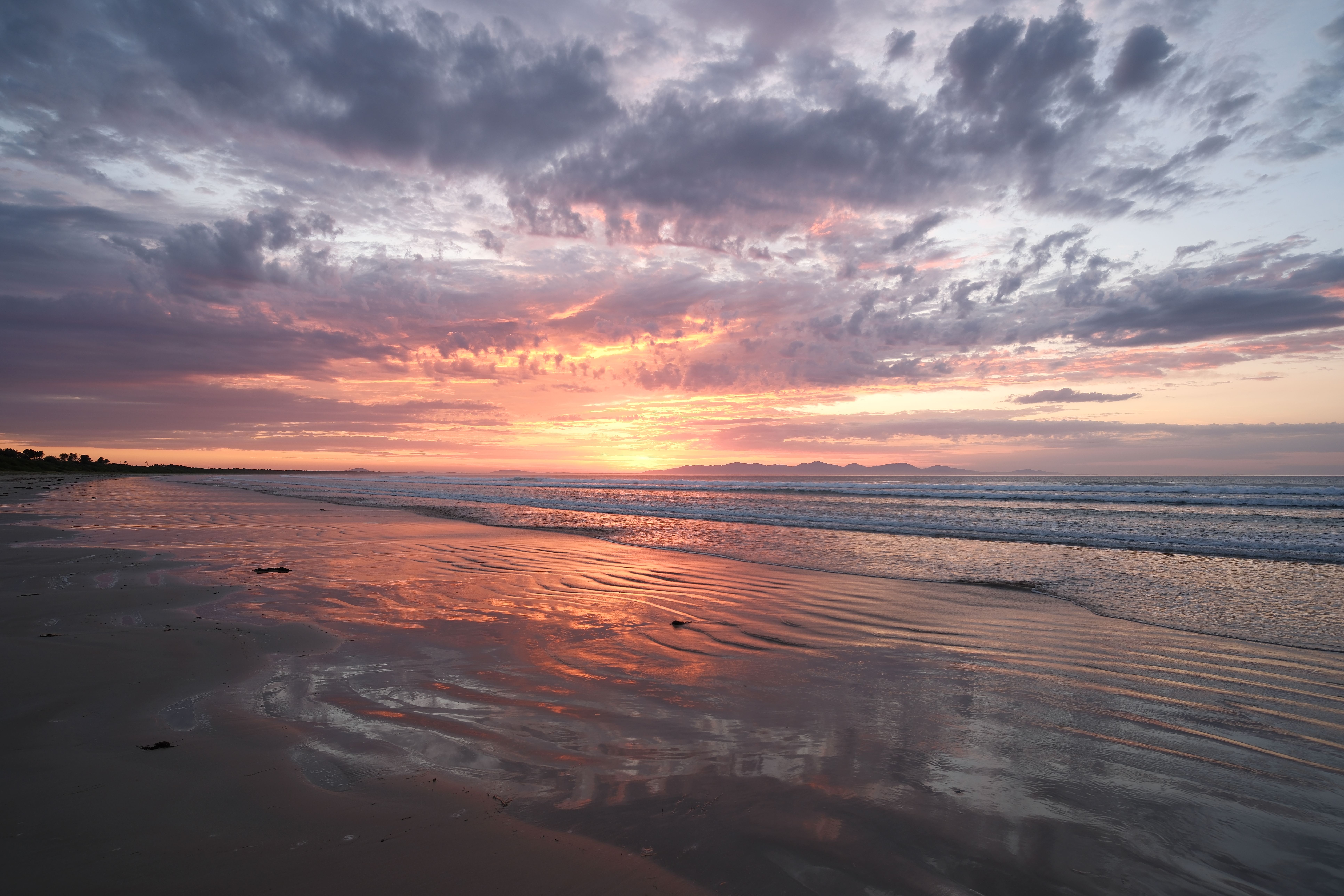 Stunning Beach Sunset with Vibrant Skies · Free Stock Photo